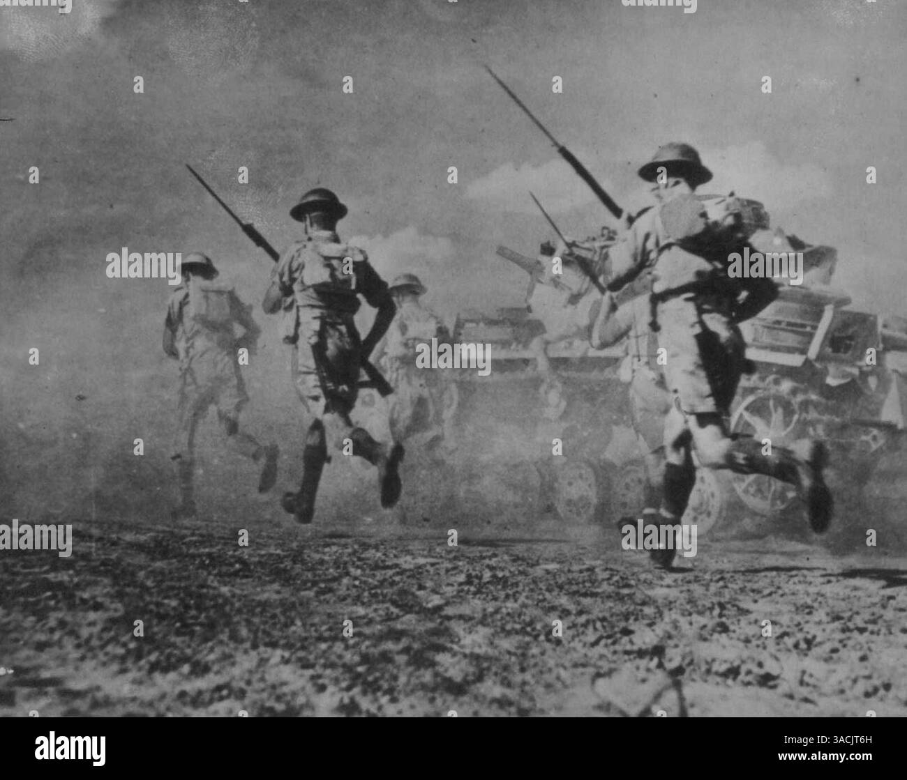 British Eighth Army infantry men run through the dust of the Western ...