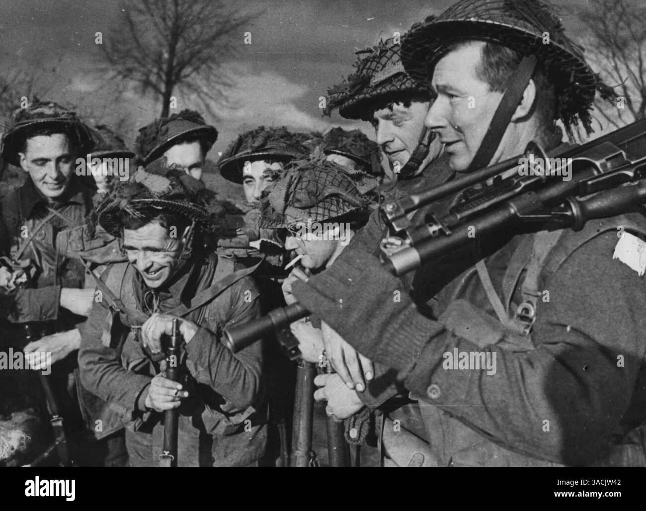 British 2nd Army Front: The Advance to Venlo. British Infantry men halt ...