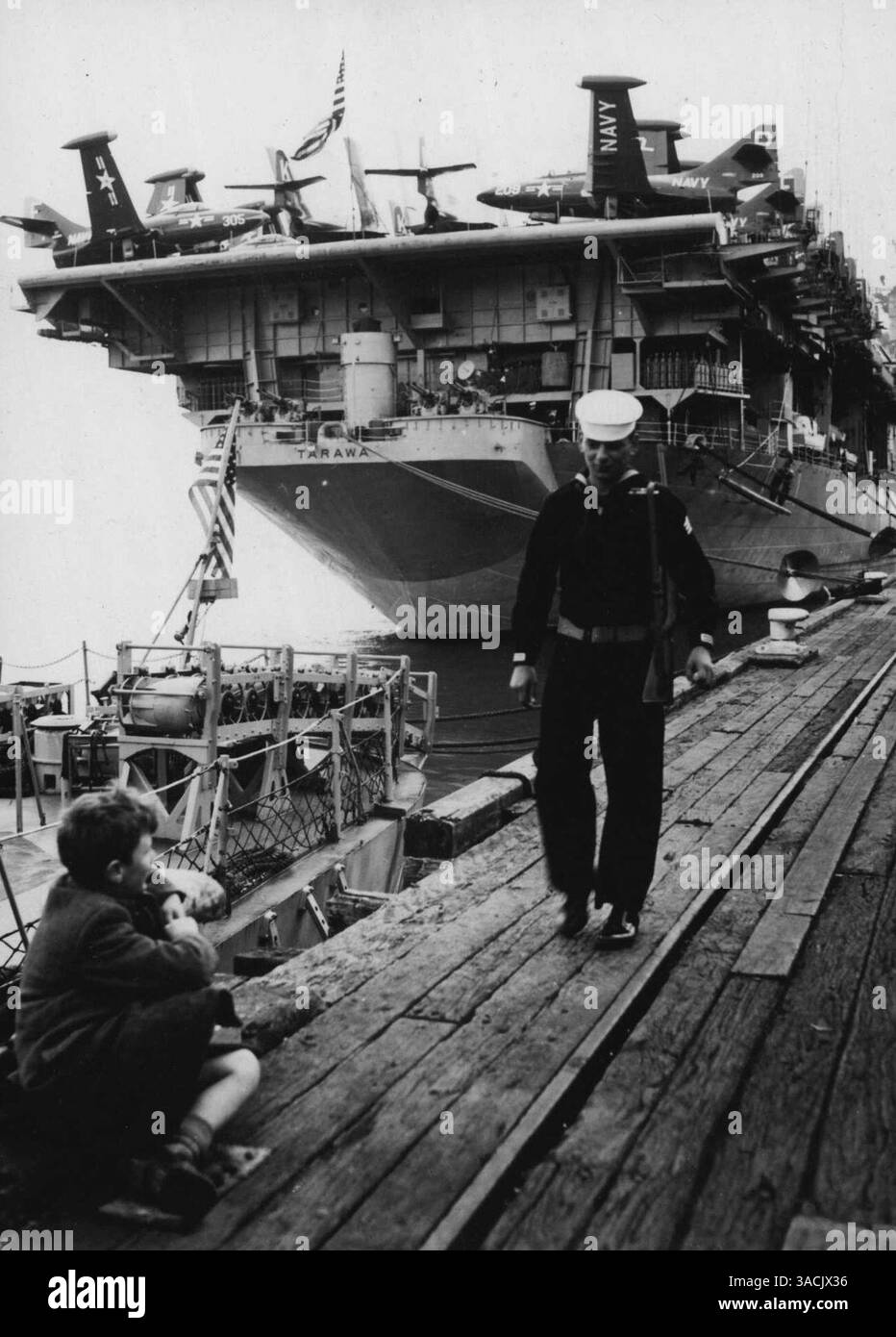 Keeping A Watch: This small boy watched Seaman First Class Joe ...