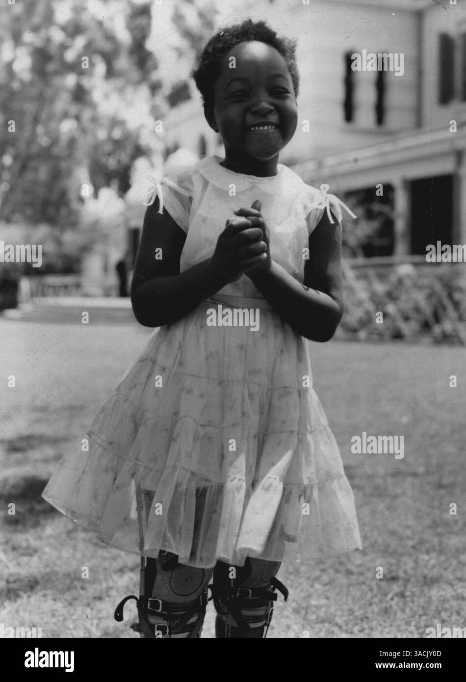 Tiny Princess Dorothy, daughter of the Kabaka (King) of Bugand laughing ...