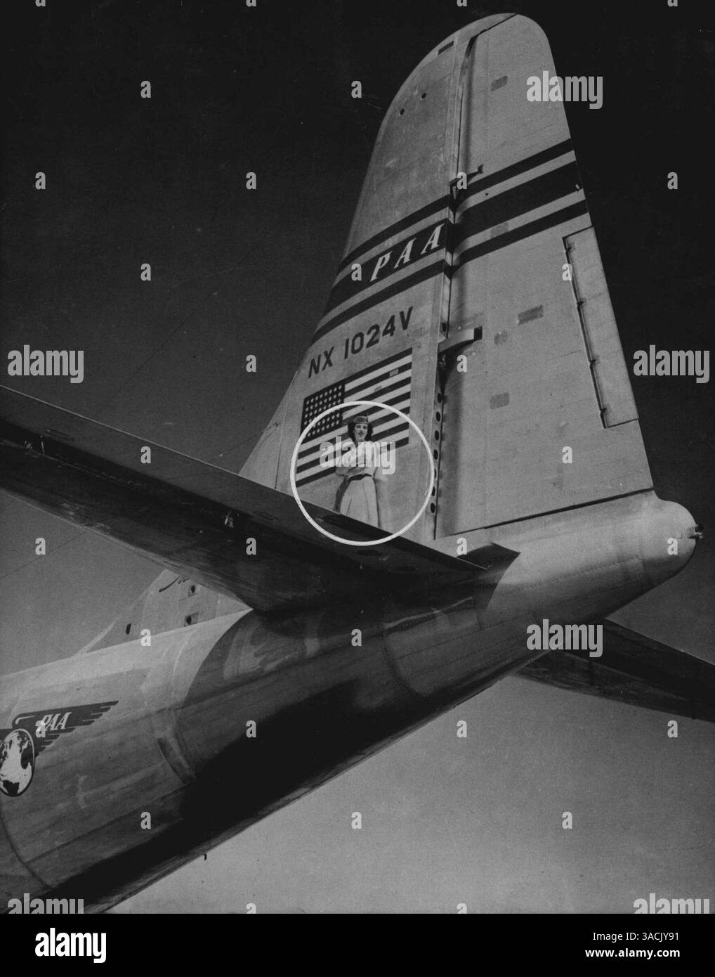 World's Largest Landplane - The stewardess standing against the huge ...