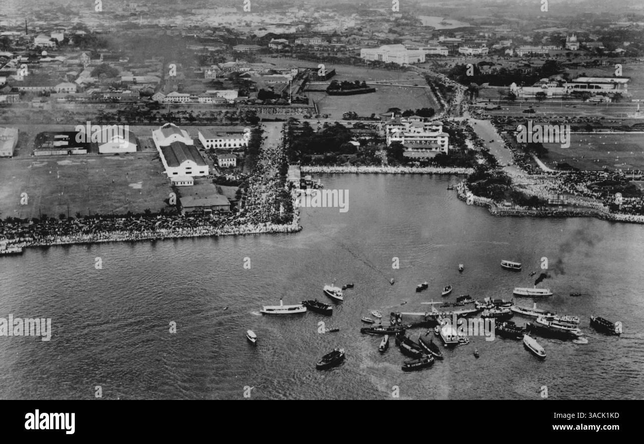 The China Clipper is moored to Pan Am's landing stage in Manila Bay ...