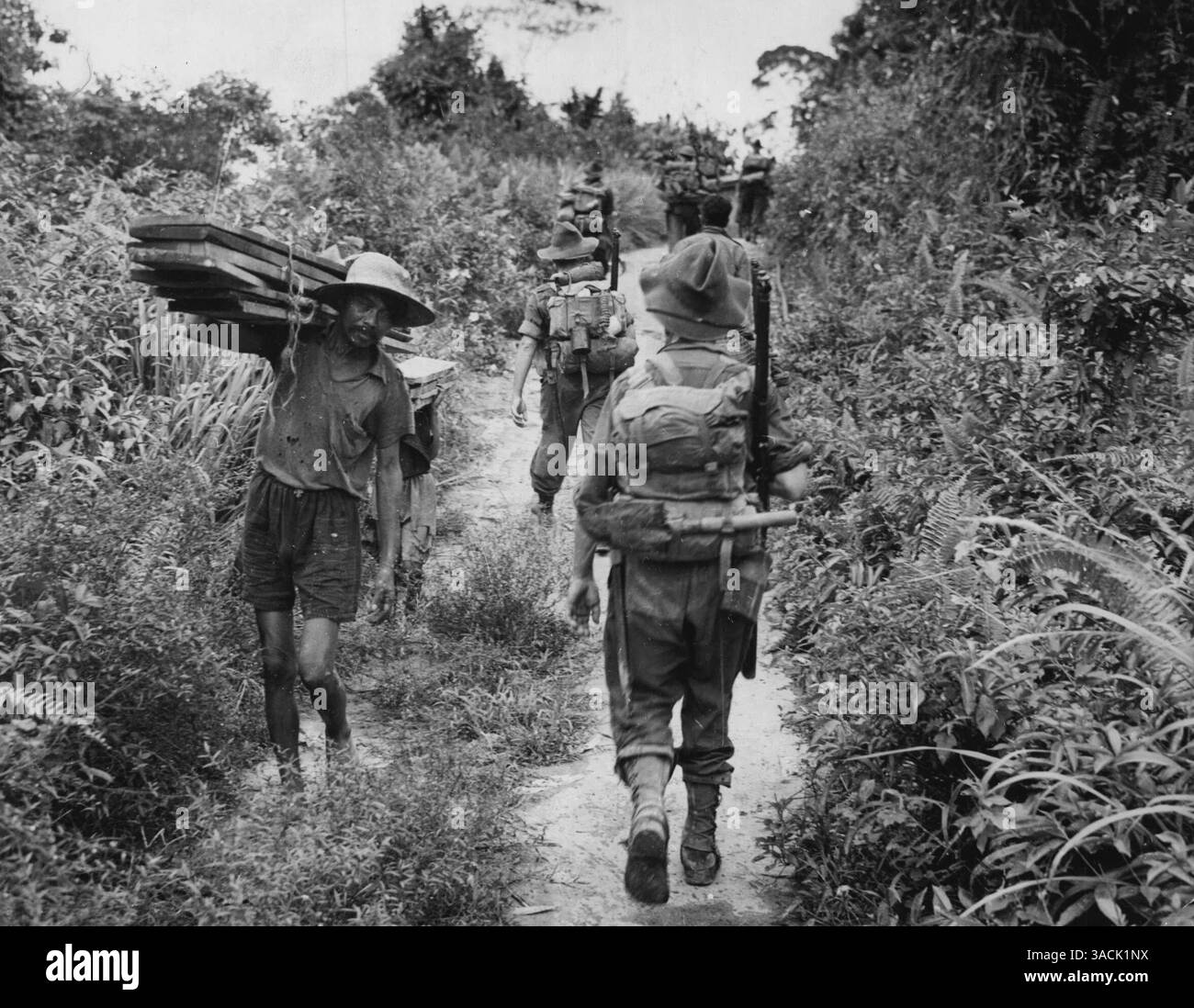 A native civilian pauses our troops on the outskirts or Samboja, 38 ...