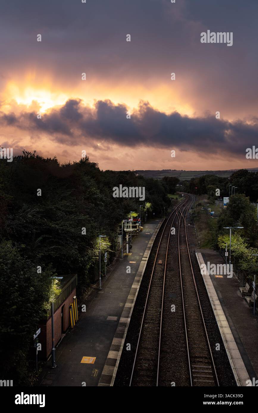 rail line at station going west into Cornwall at sunset Stock Photo - Alamy