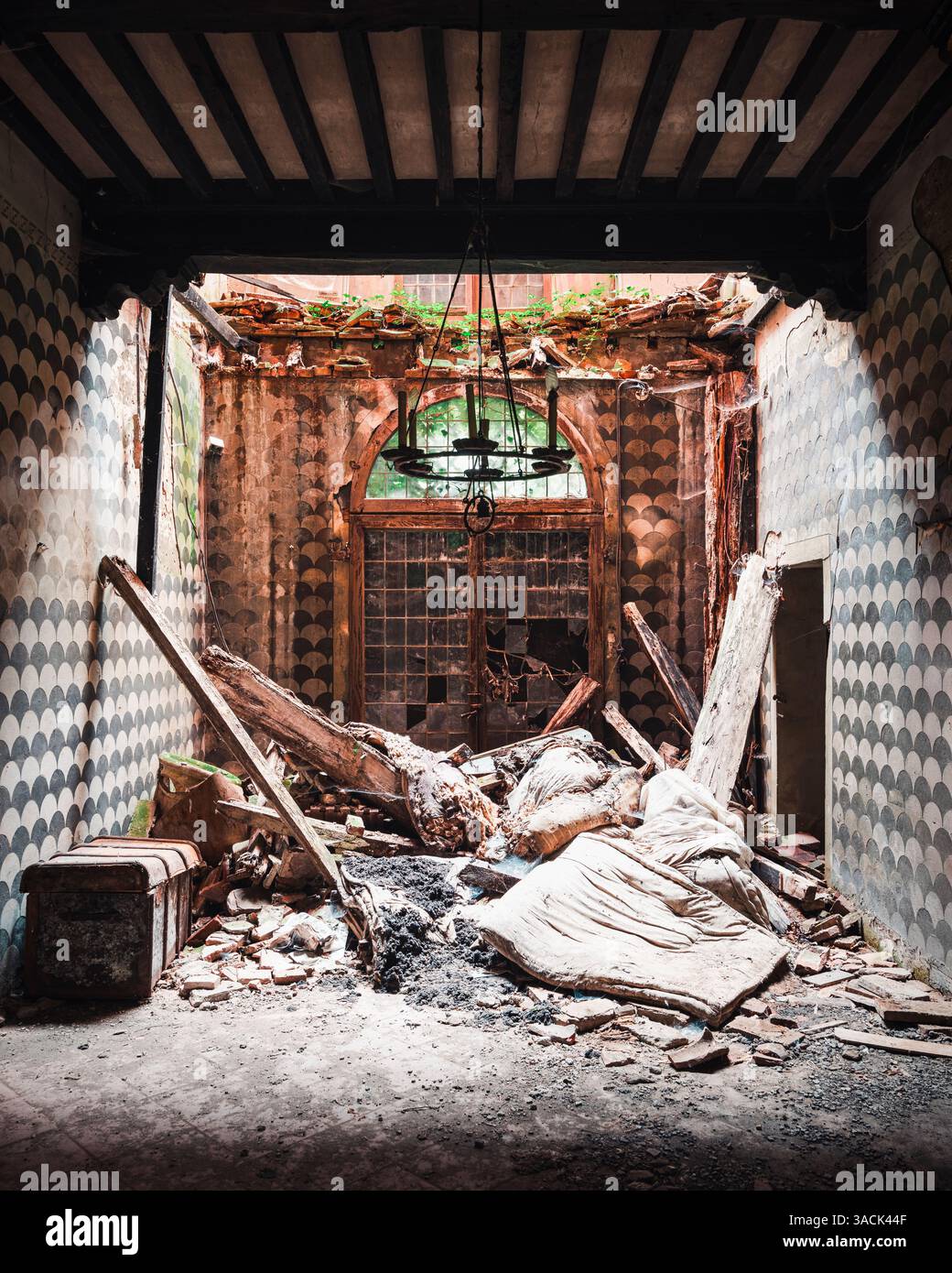 Decaying interior of an abandoned building with peeling paint and ...
