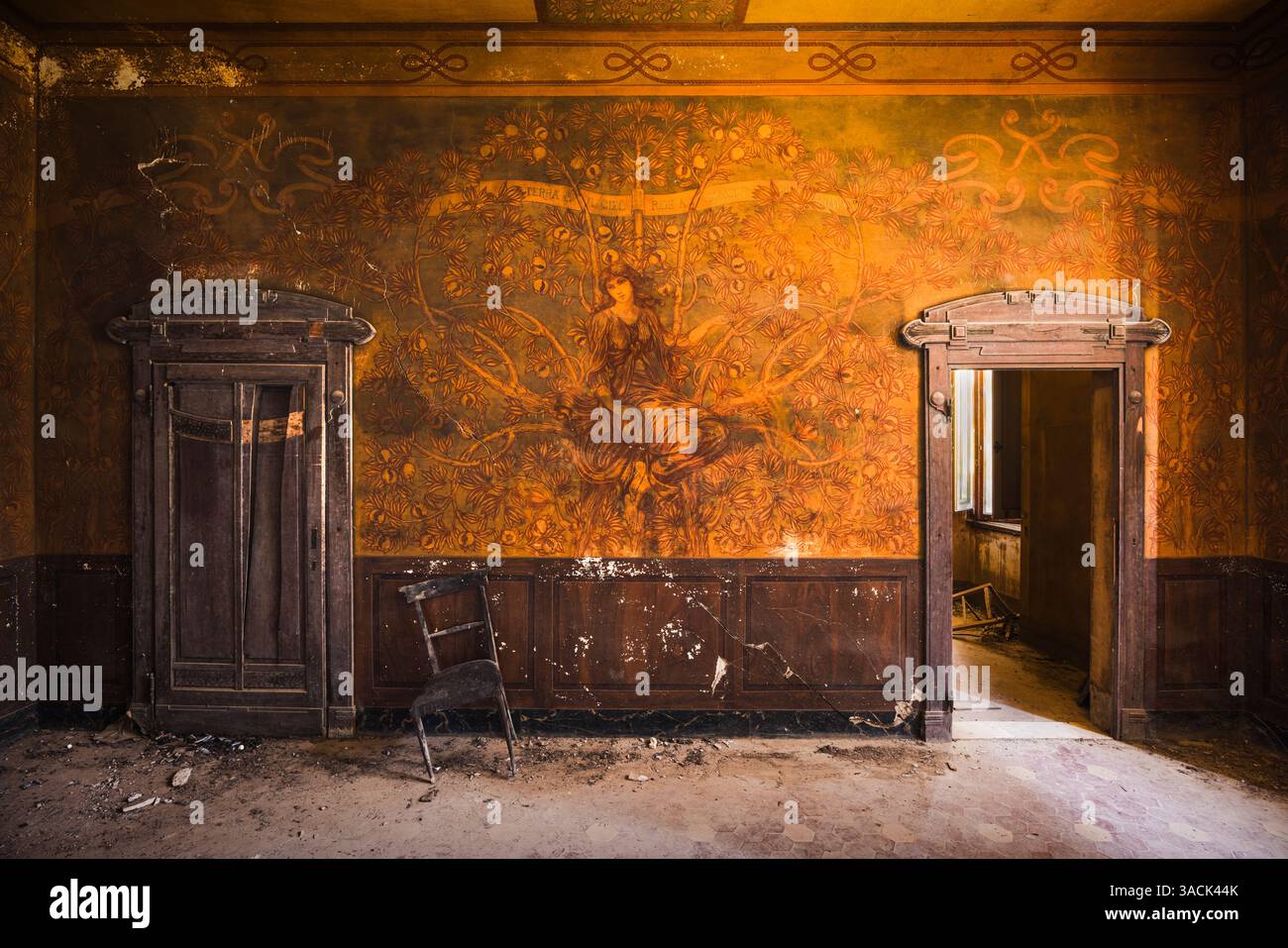 Decaying interior of an abandoned building with peeling paint and ...