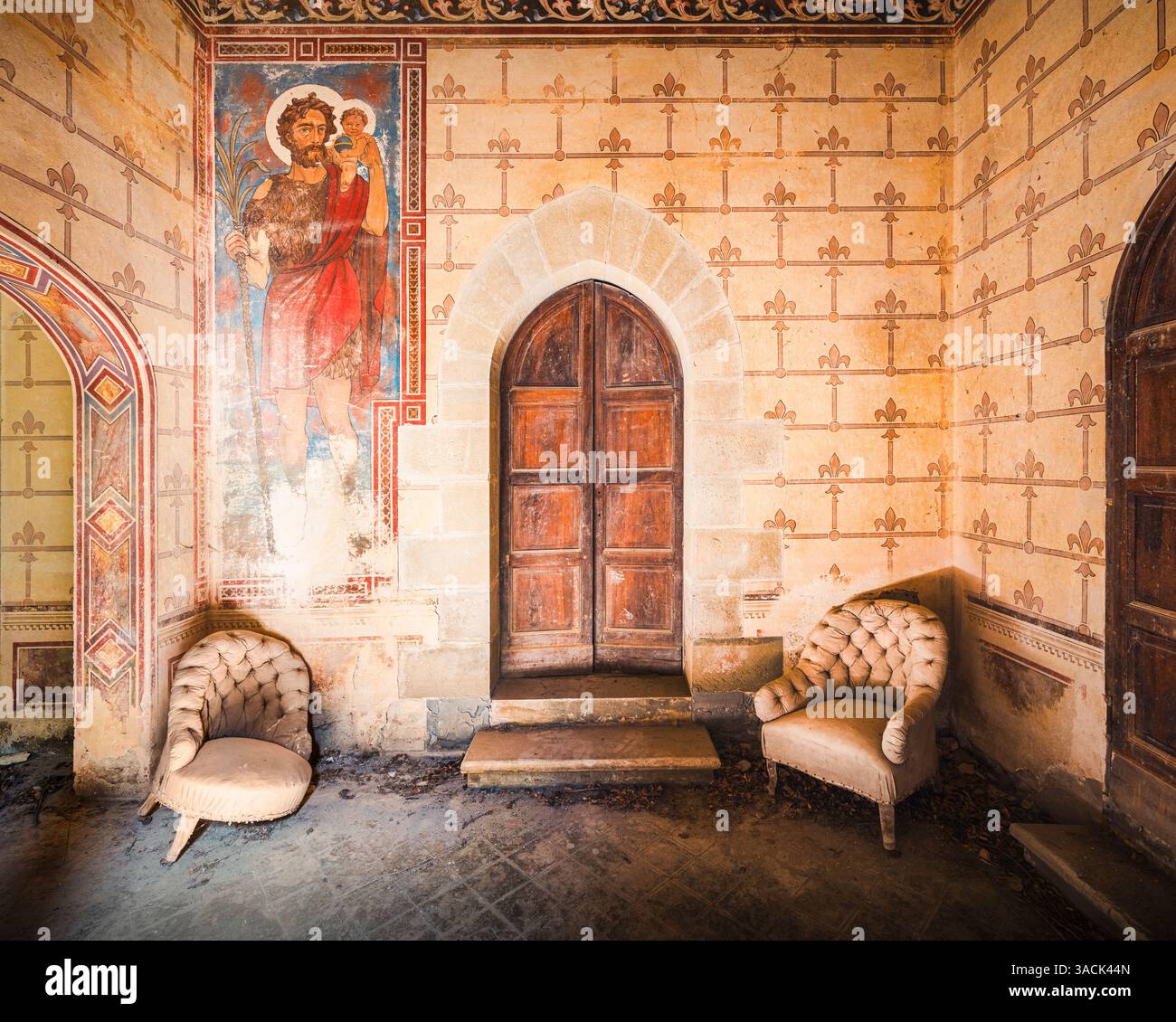Decaying interior of an abandoned building with peeling paint and ...