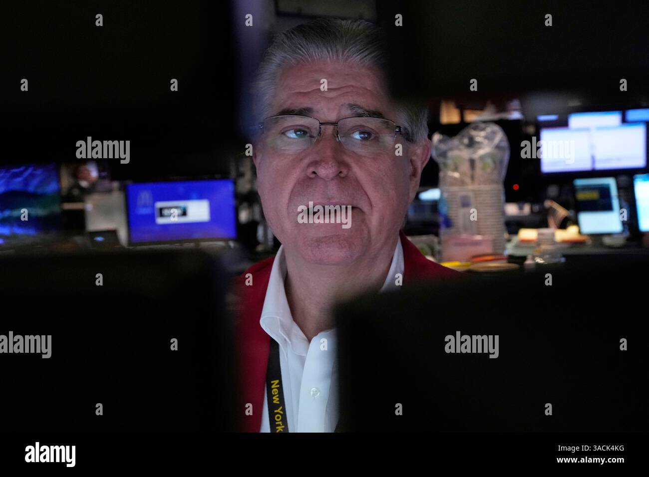 Trader Daniel Kryger works on the floor of the New York Stock Exchange ...