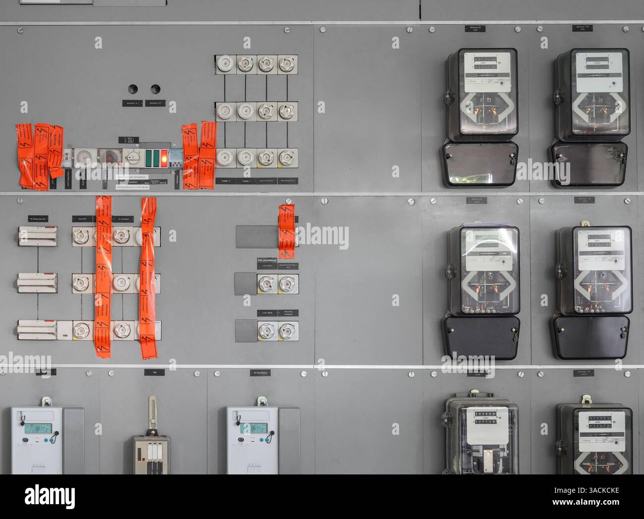 Old electrical power meter with tape over fuses in Switzerland. Power ...