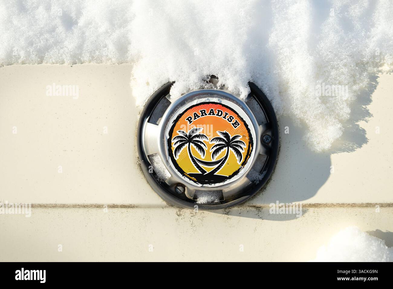 Snowed in car with summer holiday paradise sticker after an arctic snow ...