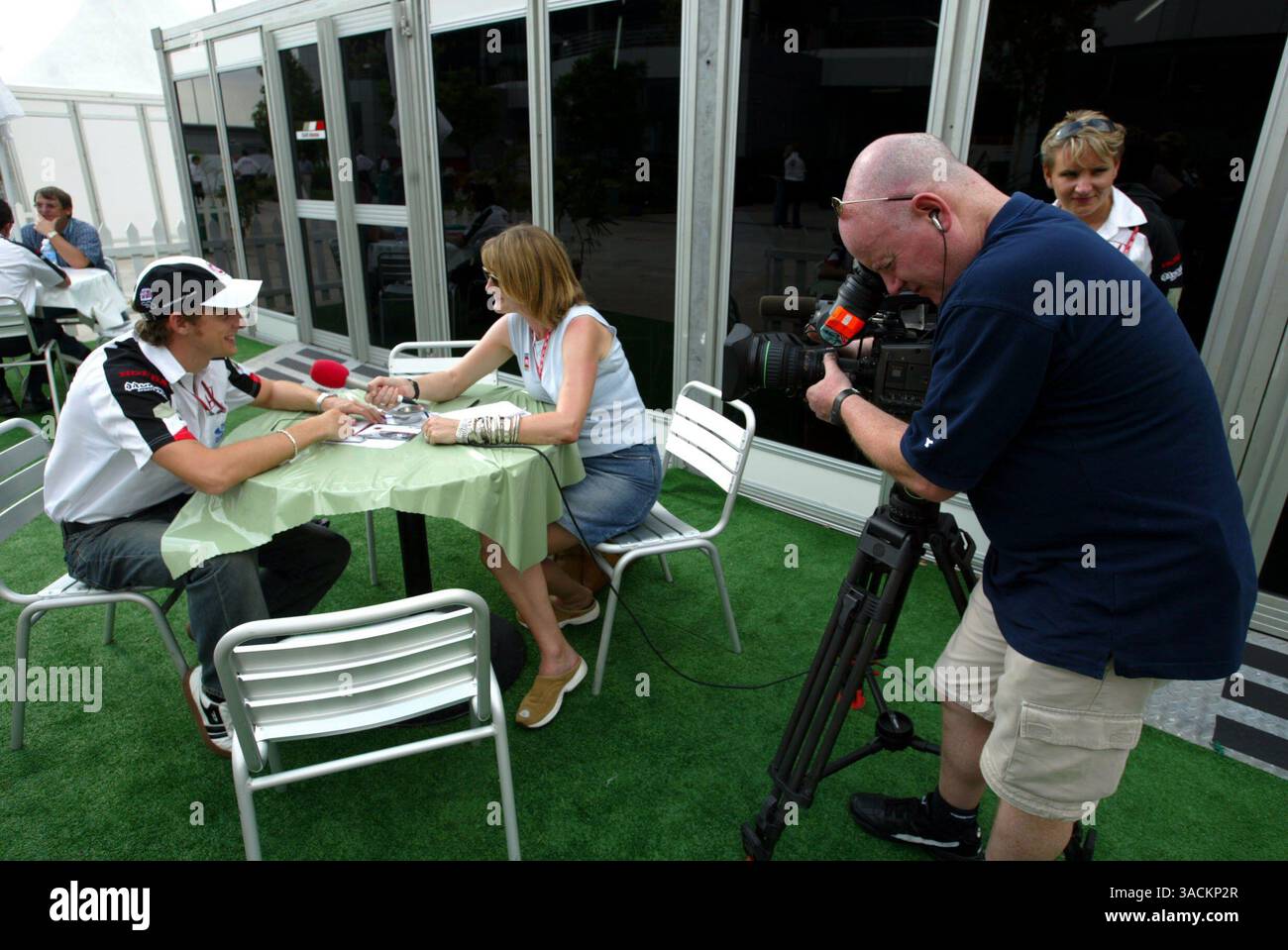Jenson Button (GBR) BAR is interviewed by ITV-F1 pitlane reporter ...