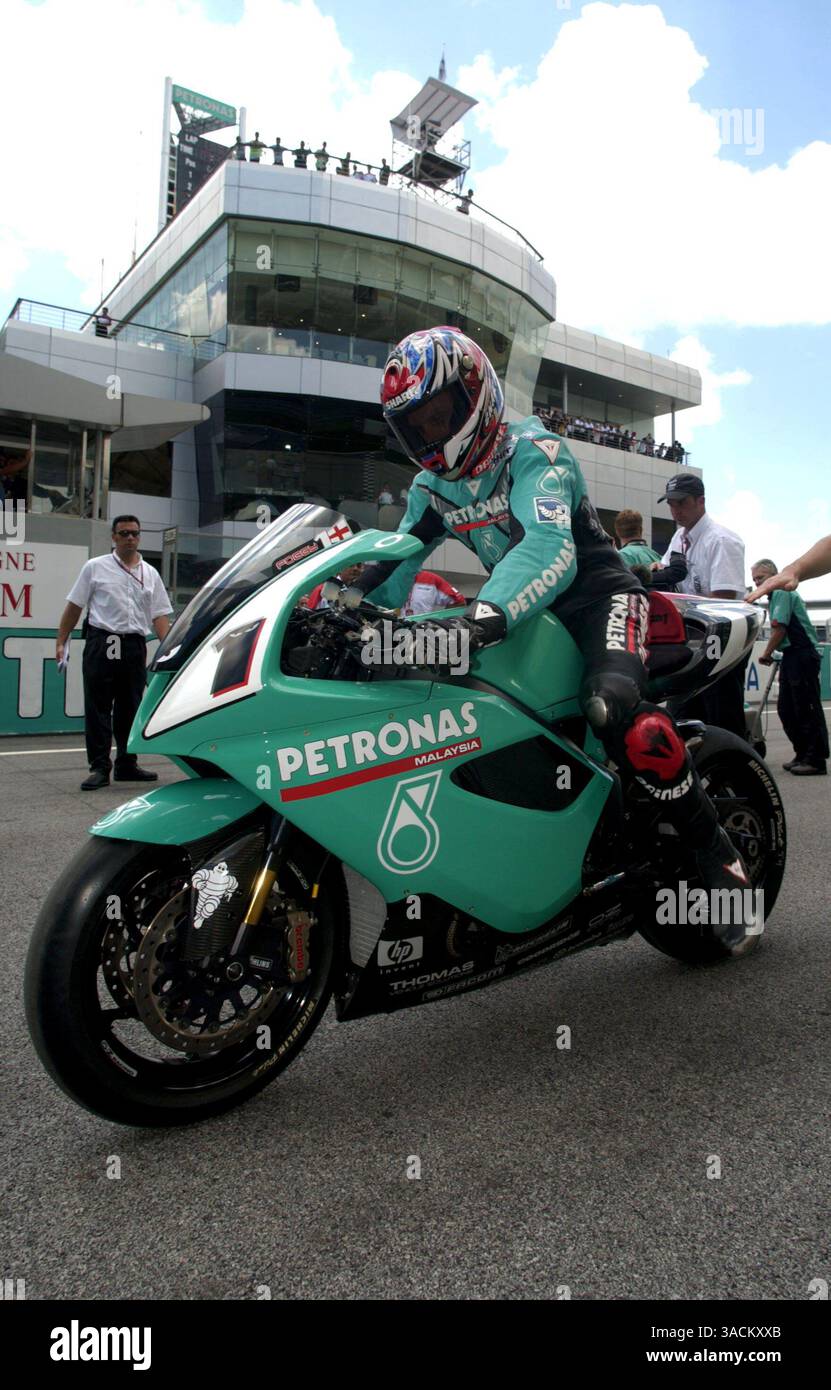 Carl Fogarty (GBR) Foggy Team Petronas Team Owner demonstrates the bike ...