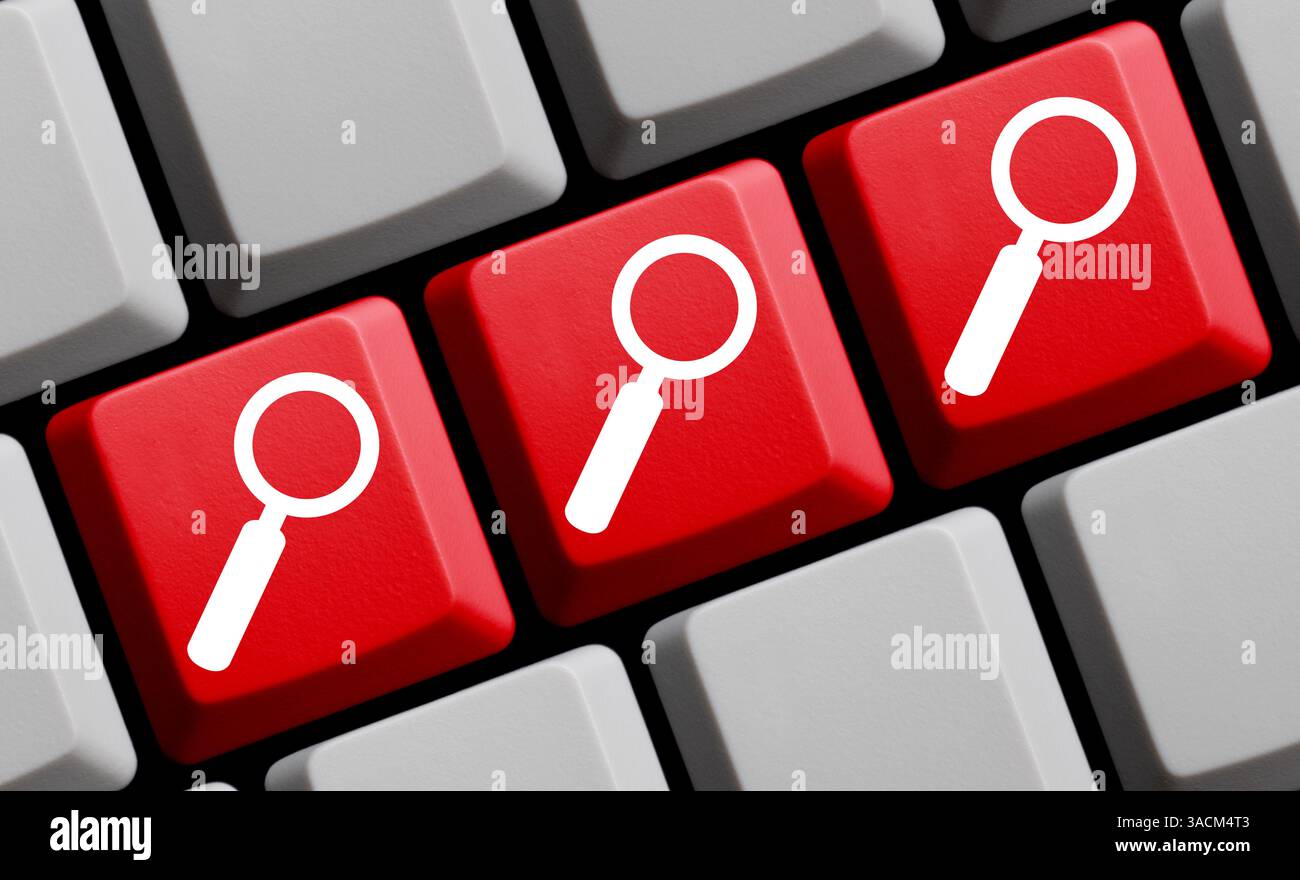 Three magnifying glass symbols on computer keyboard hi-res stock ...