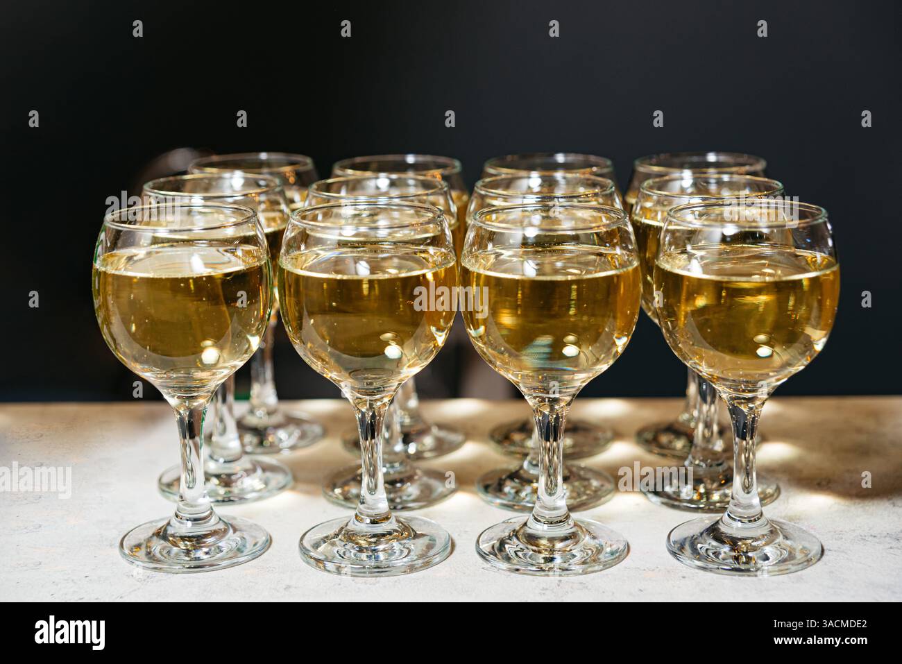 Multiple glasses filled white hi-res stock photography and images - Alamy