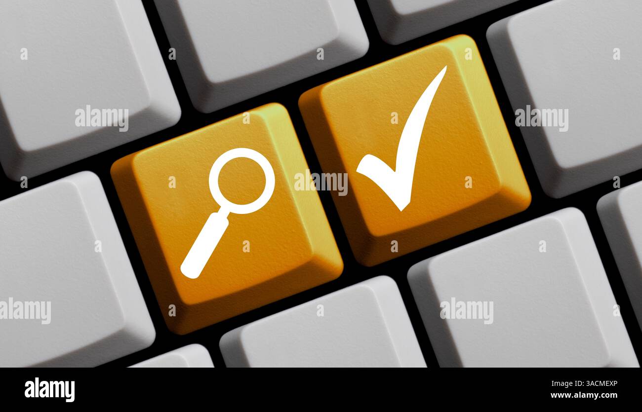 Yellow computer keyboard with magnifying glass shows search and find ...