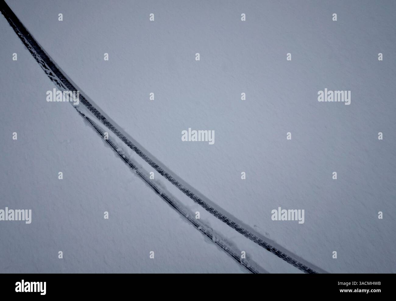 Tracks from a bike in the snow - cycling in winter Stock Photo - Alamy