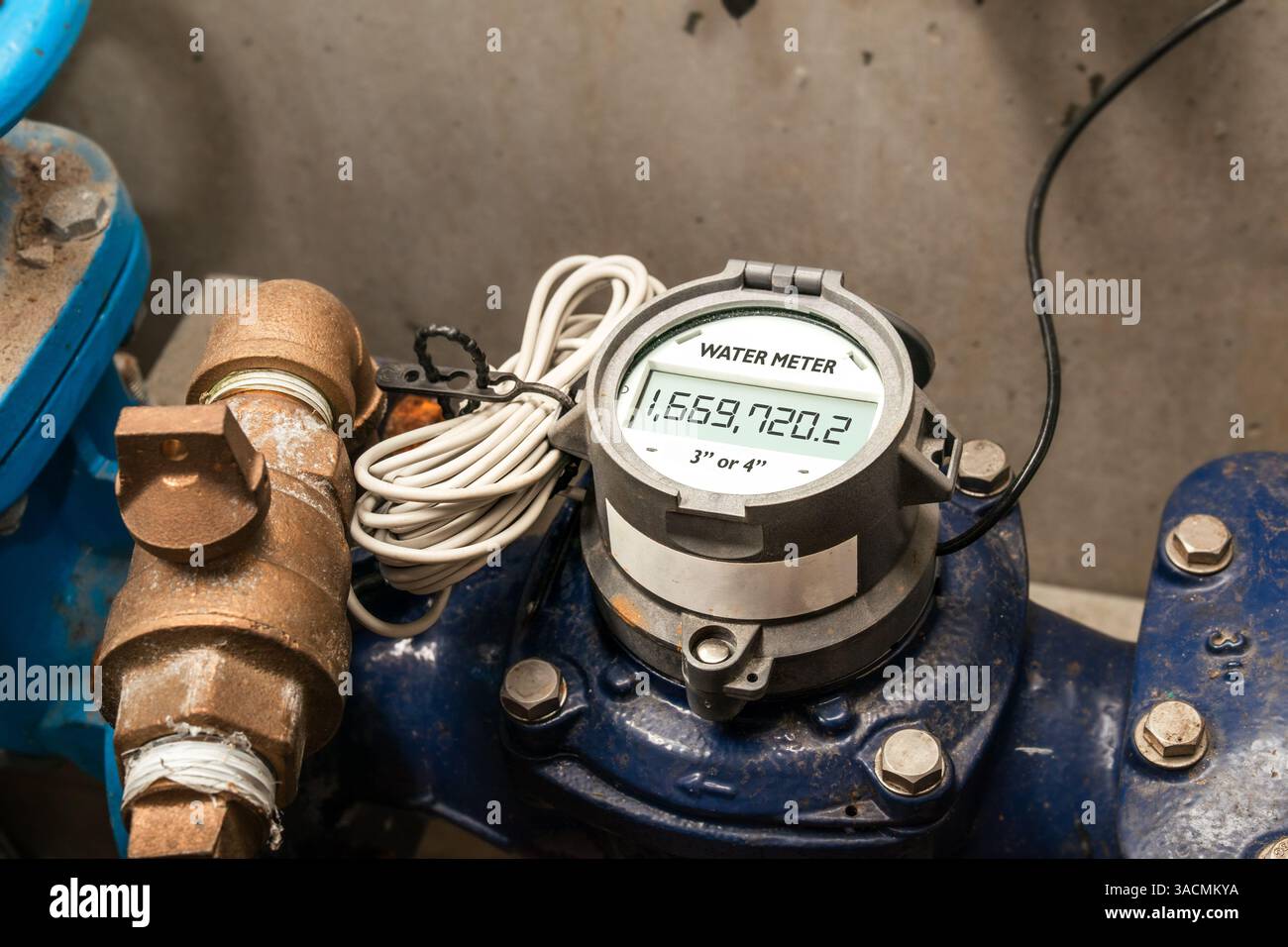 Water meter in building with commercial and residential units. Digital ...