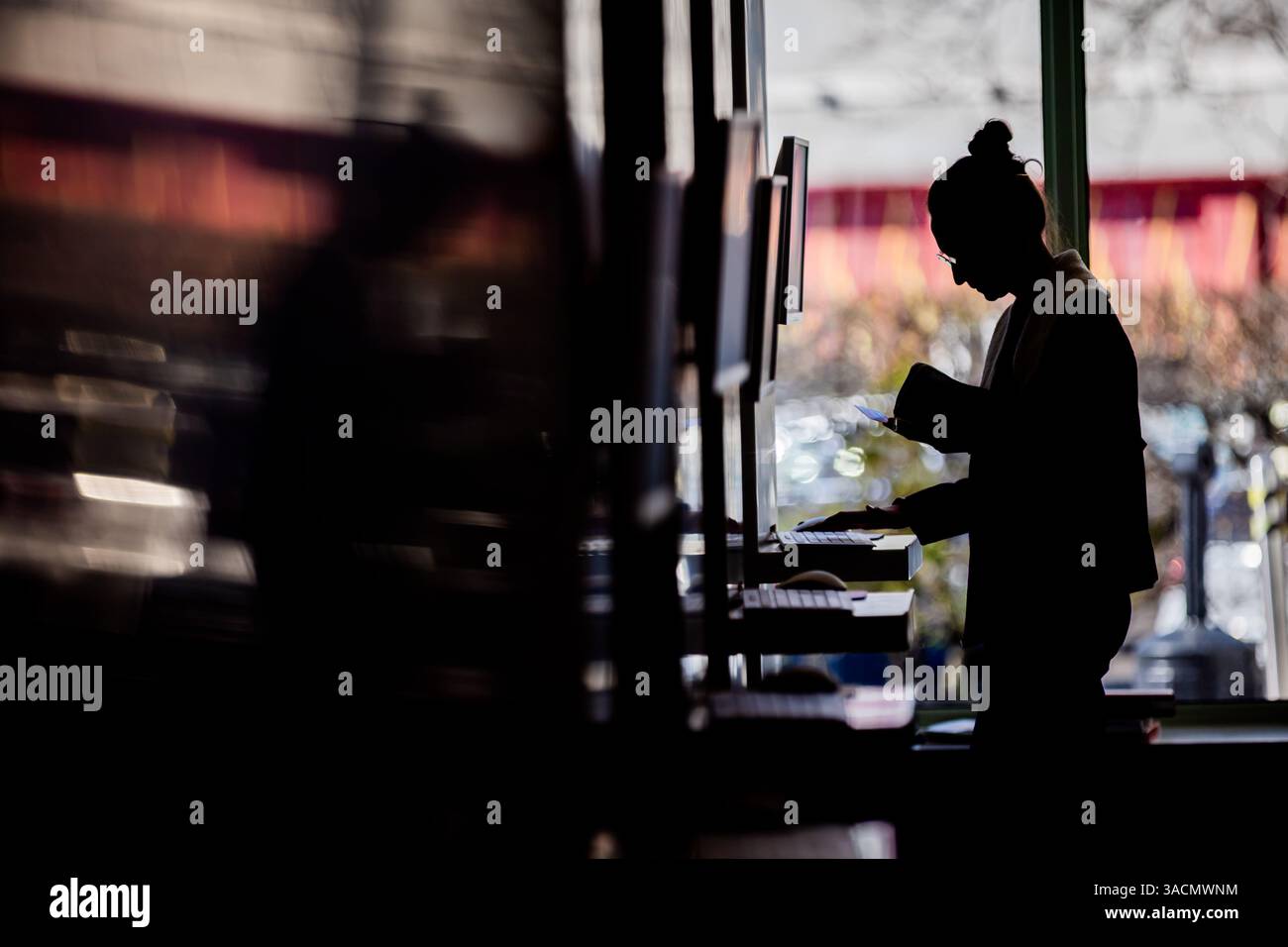 Berlin, Germany. 04th Apr, 2025. A woman stands at a computer in the ...