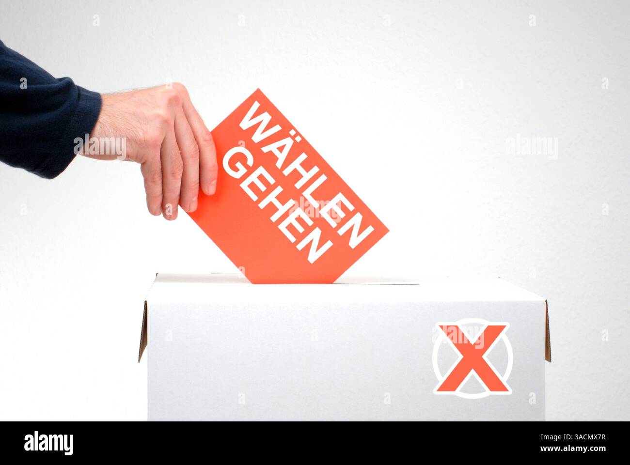 Hand throws ballot paper into ballot box hi-res stock photography and ...