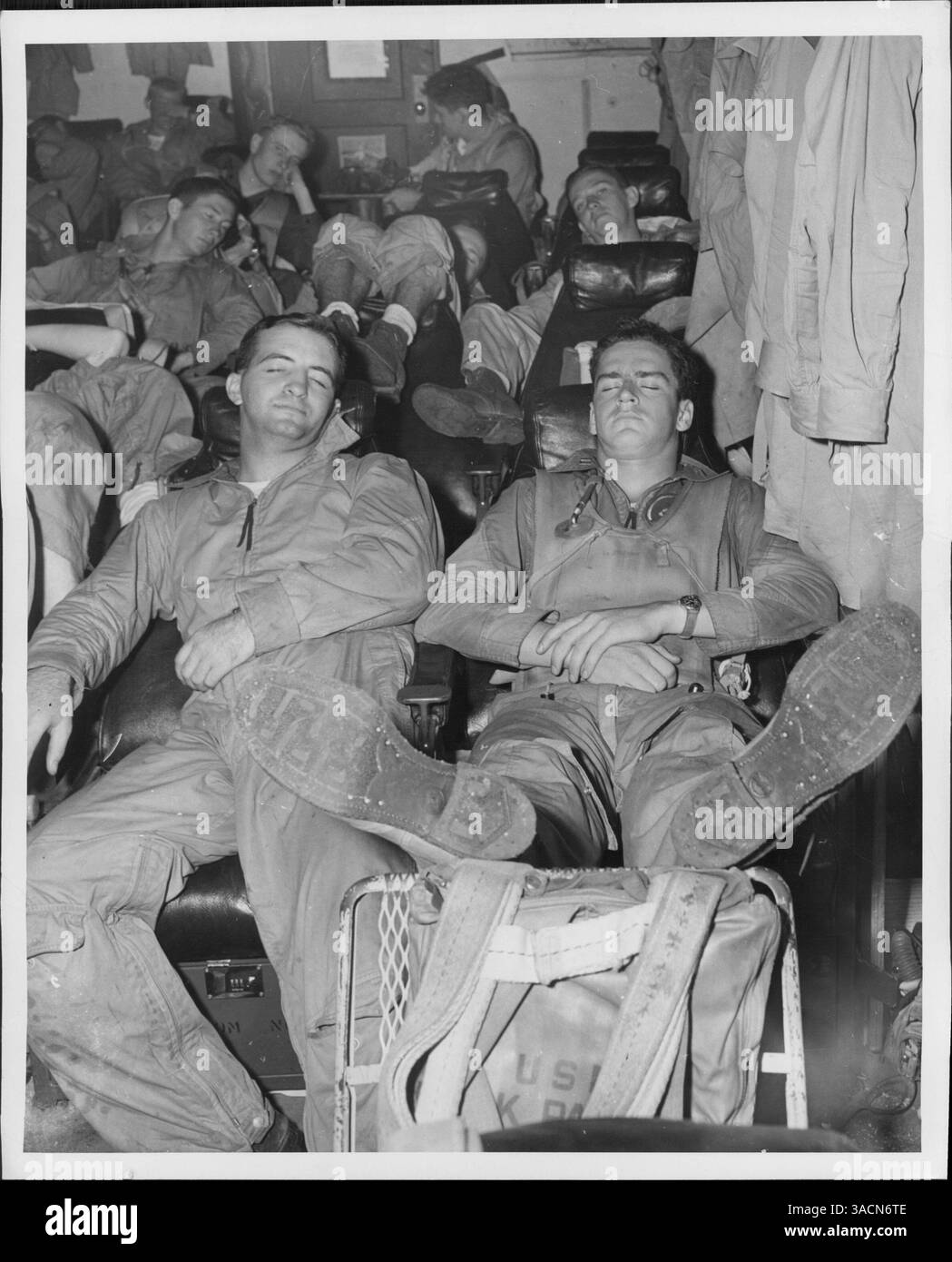 Navy pilots take a break in the ready room of an Essex-class aircraft ...