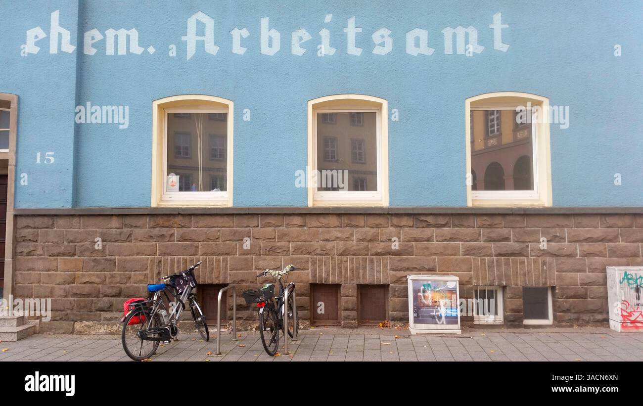 Inscription in Gothic script "former employment office" on a house wall ...