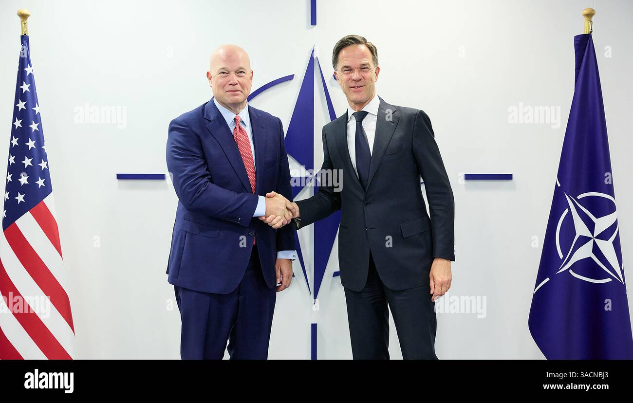 NATO Secretary General Mark Rutte (R) and United States Ambassador to ...