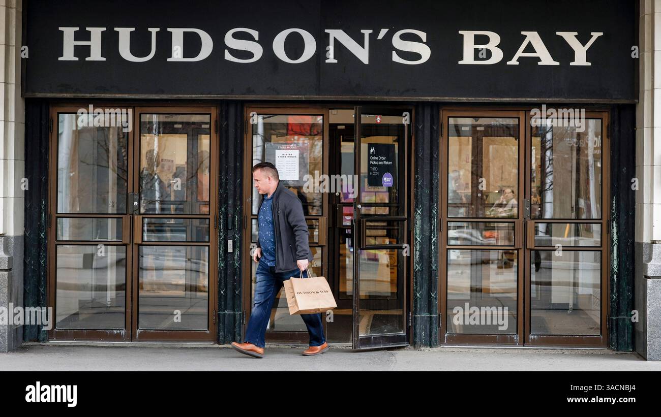 Calgary, Canada. 20th Mar, 2025. A shopper leaves the Hudson's Bay ...