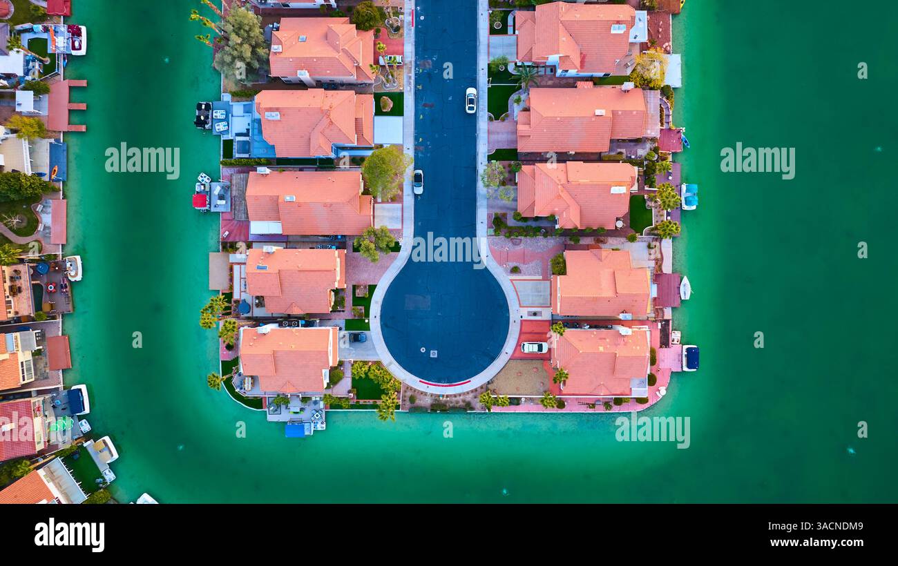 Aerial Top Down of Symmetrical Waterfront Suburb with Emerald Waters ...
