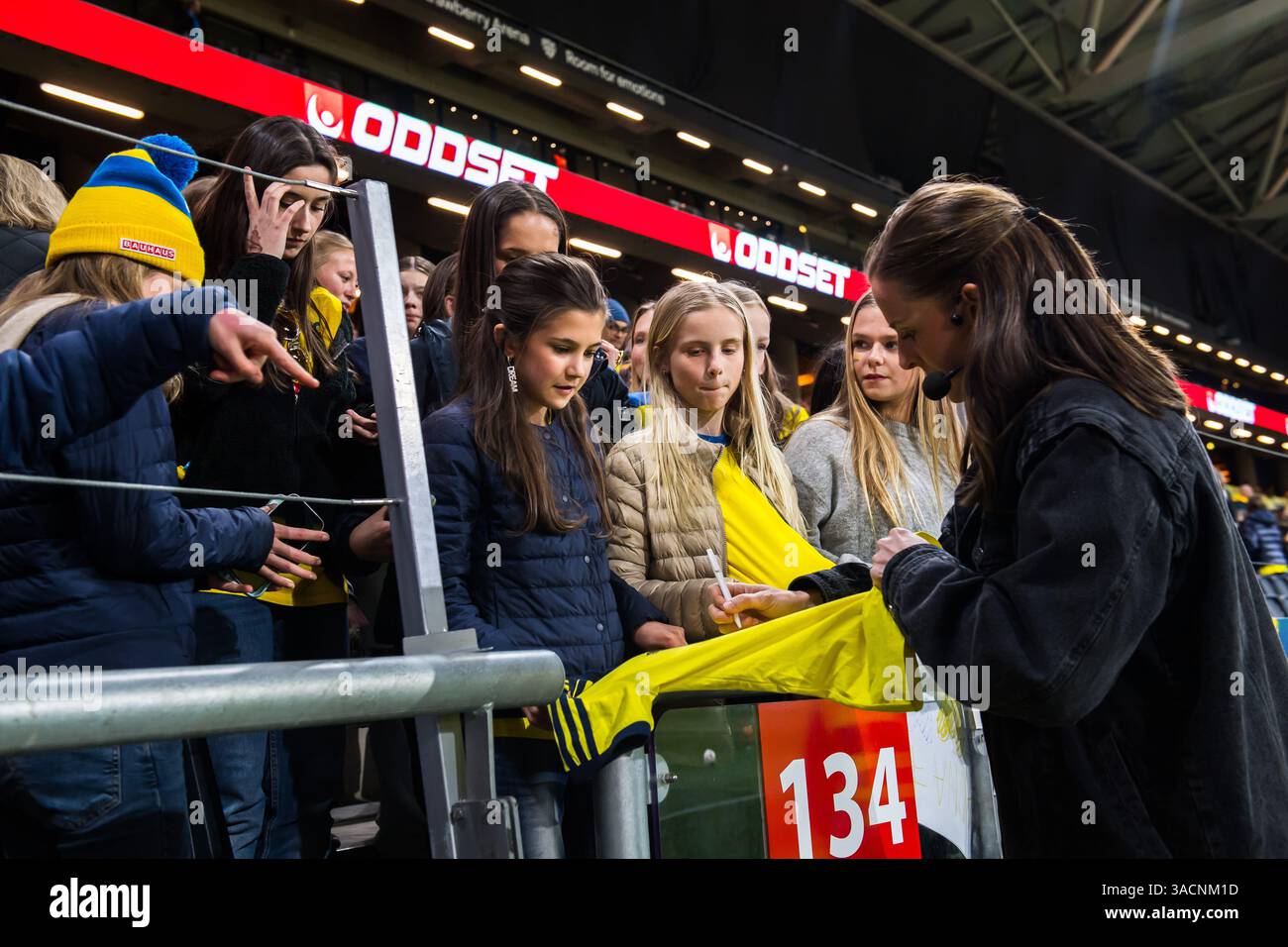 Lotta Schelin, of Swedish broadcaster SVT, signs autographs for fans ...