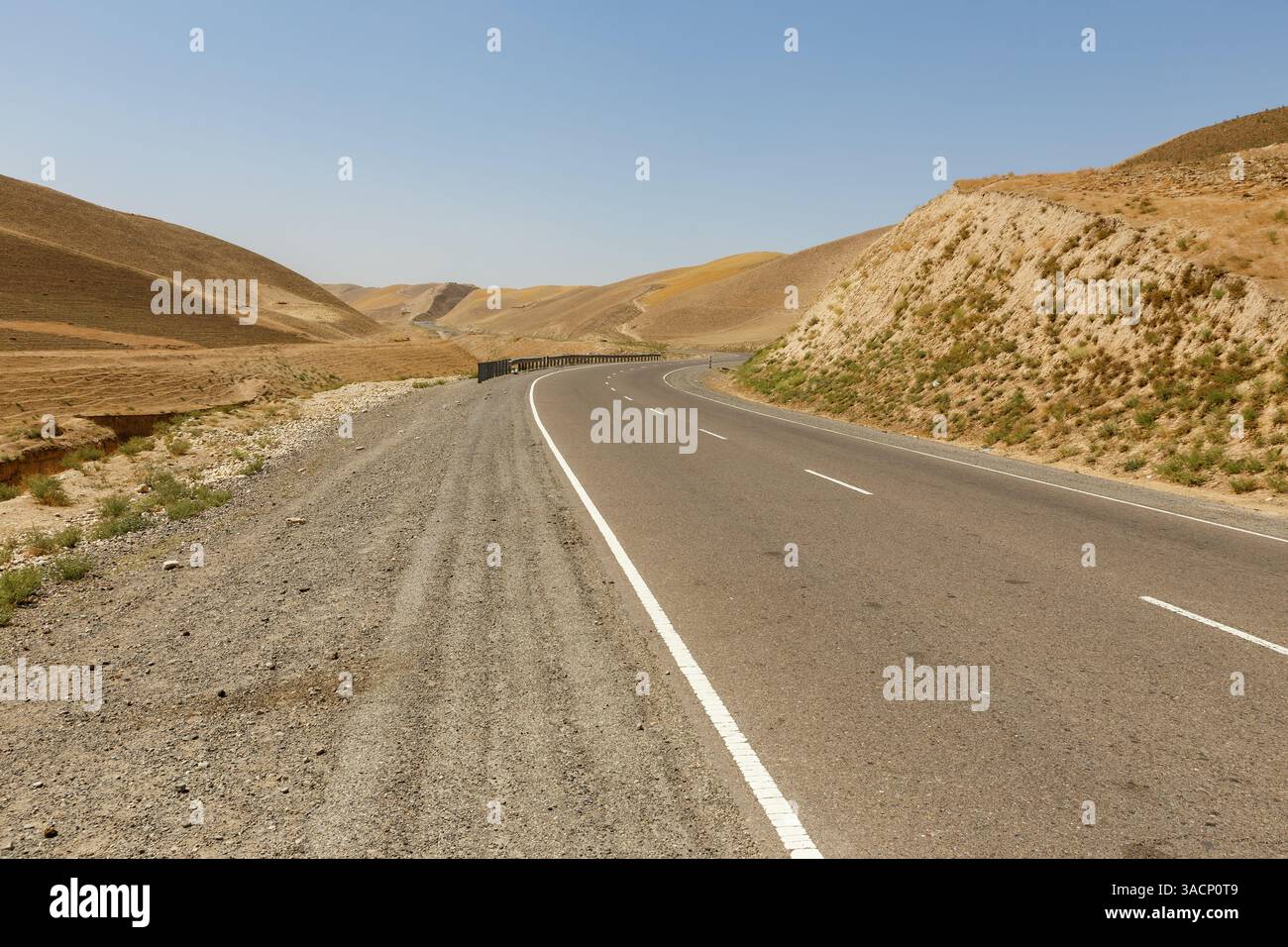 A winding road cuts through the dry, rugged terrain of Faryab Province ...