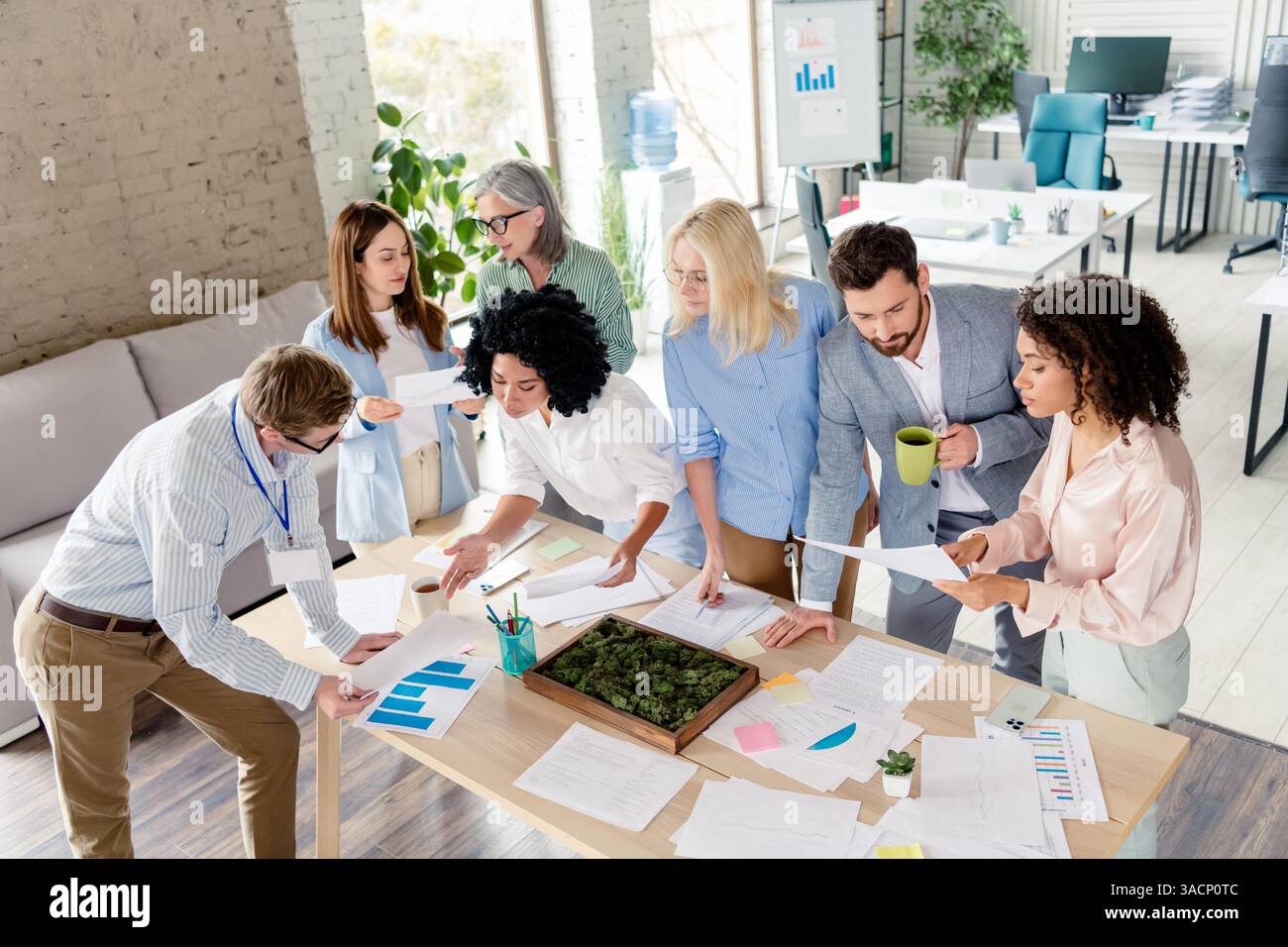 Professional team collaborating on business tasks at a modern office ...