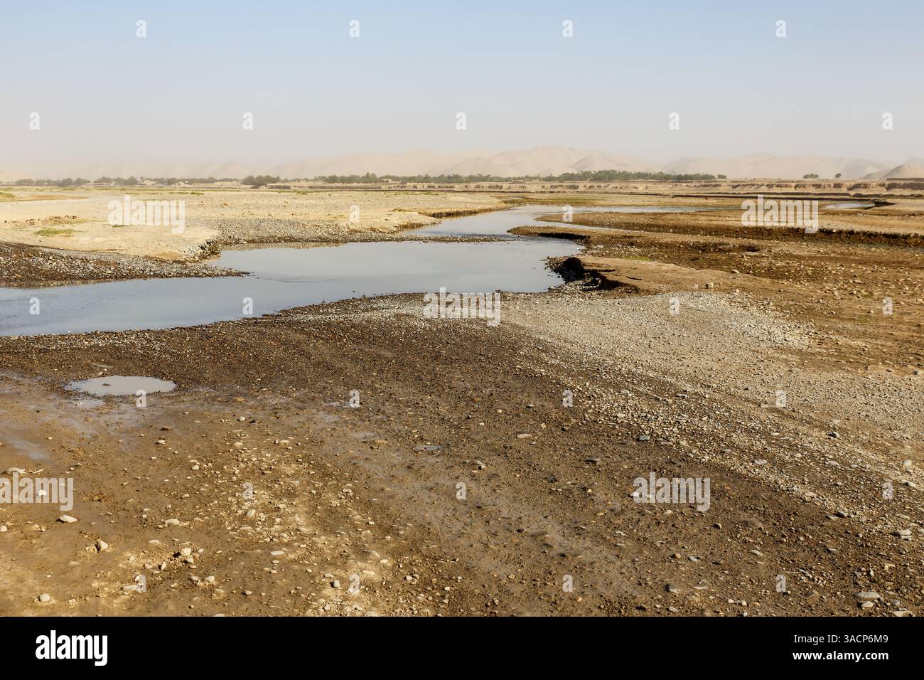 Dry riverbed and arid landscape in Ghormach District, Badghis Province ...