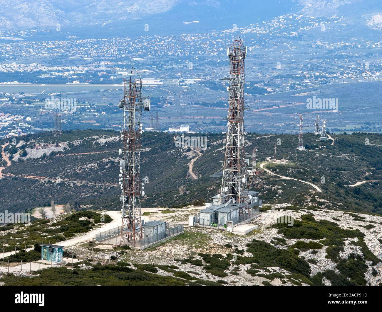 Communication Towers with satellite dishes and antennas on mount Penteli, Athens city aerial ...