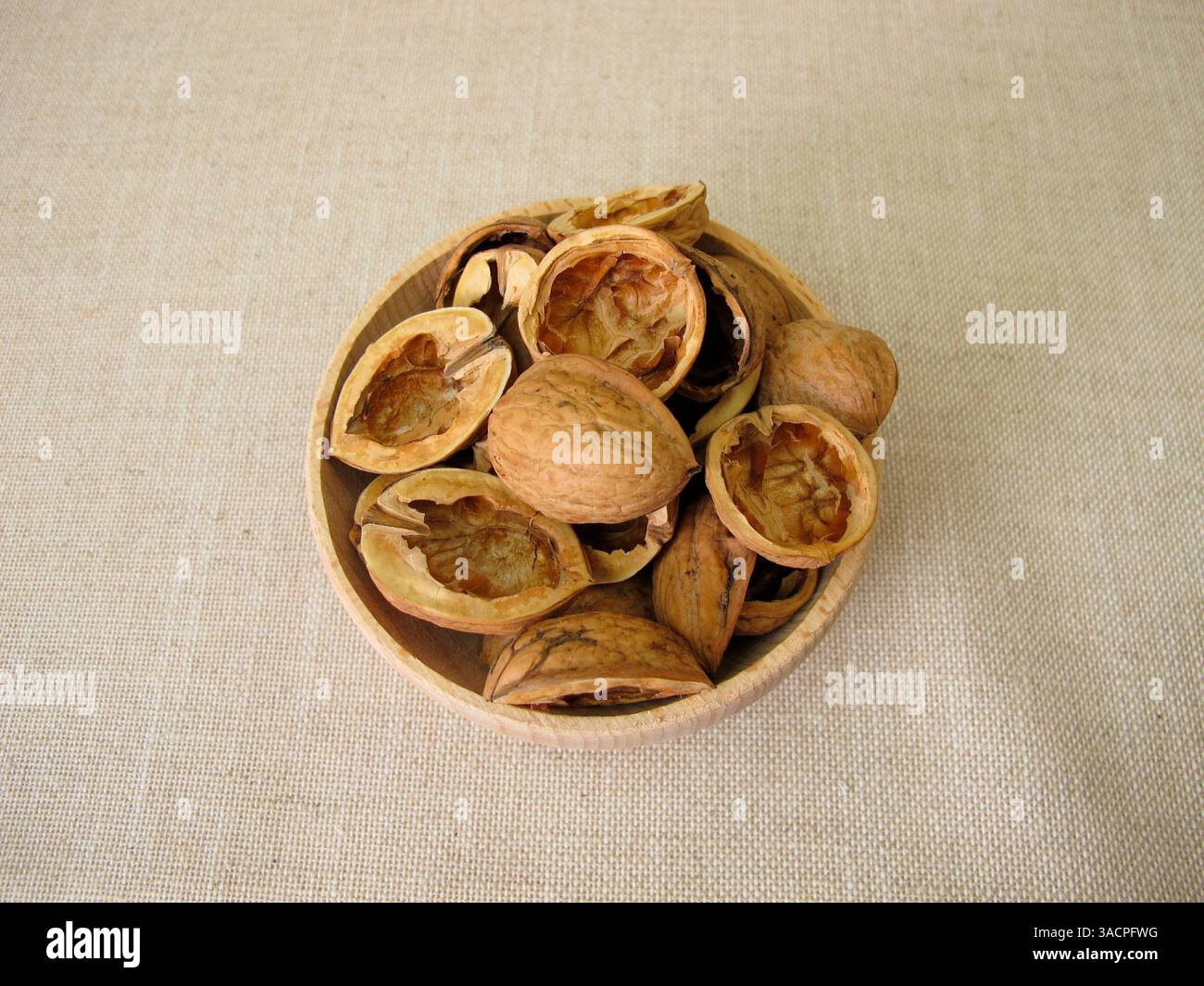 Craft materials Nutshells made from halved walnut shells in a wooden ...