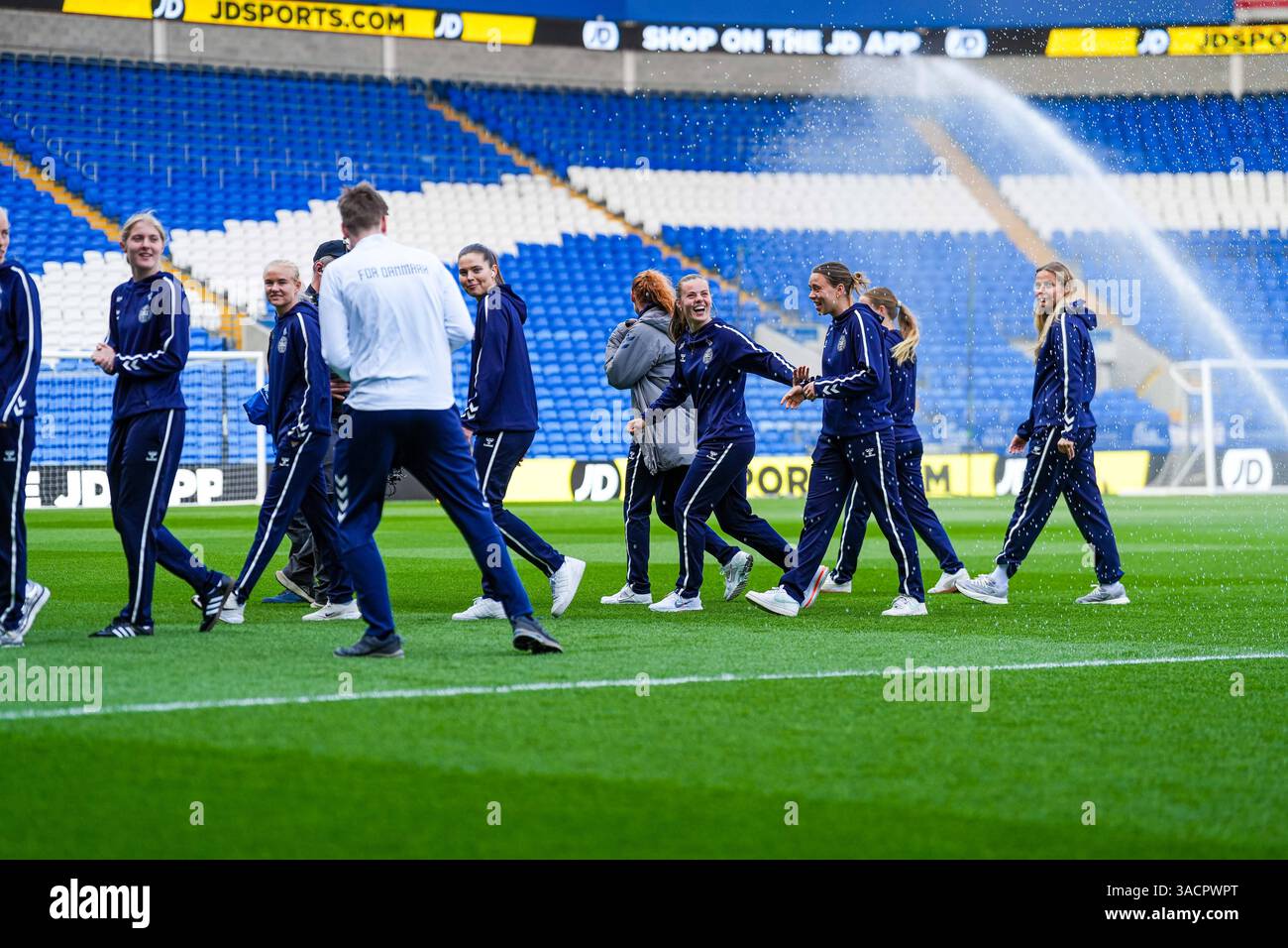 Cardiff, Wales, UK. 4th April, 2025. The Danish squad inspect the pitch ...