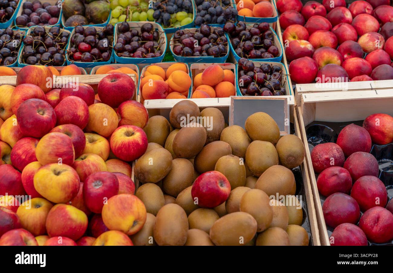 Various fruits seen at a market stall in southern France Stock Photo ...