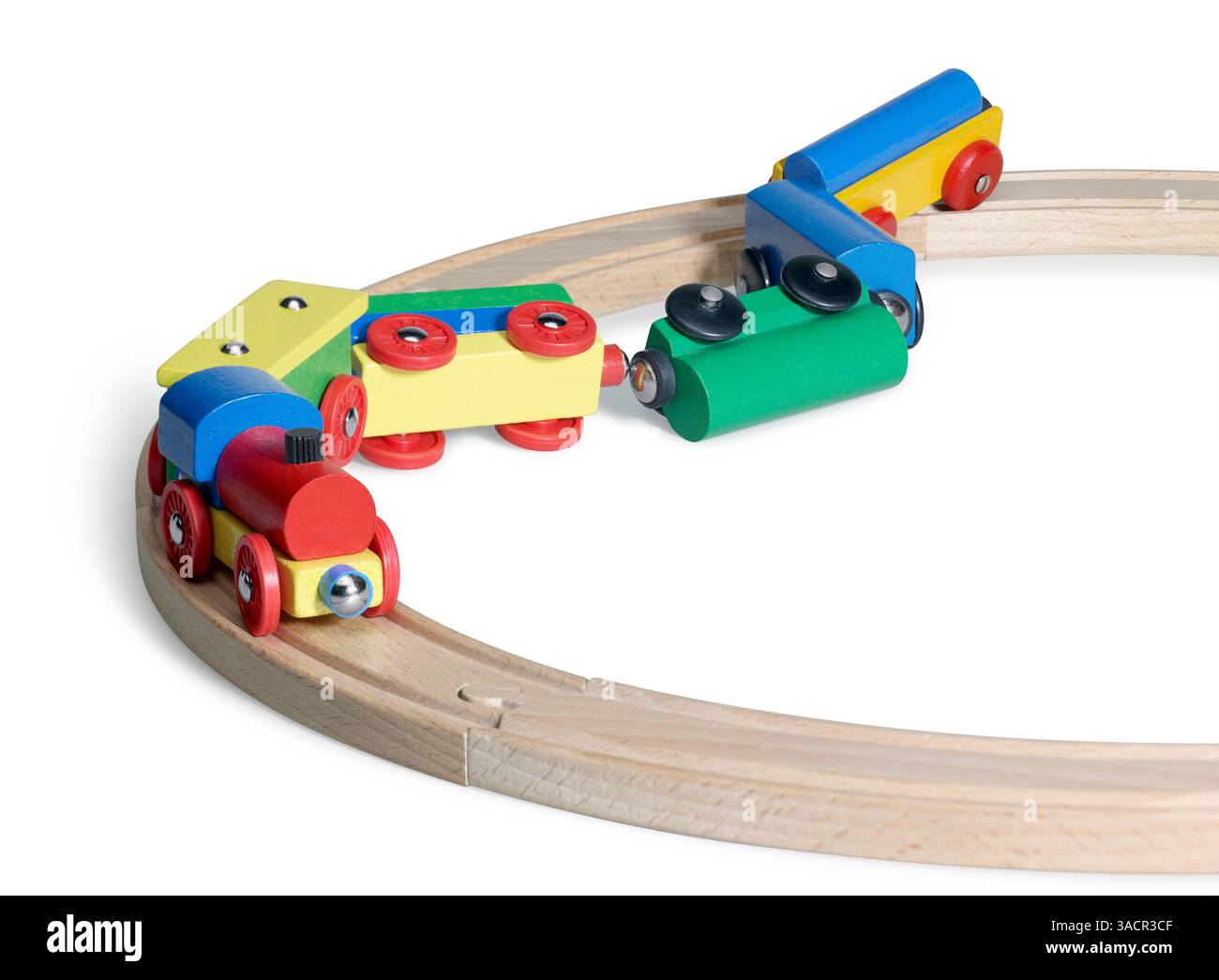Studio photography of a colorful wooden toy train on wooden tracks ...