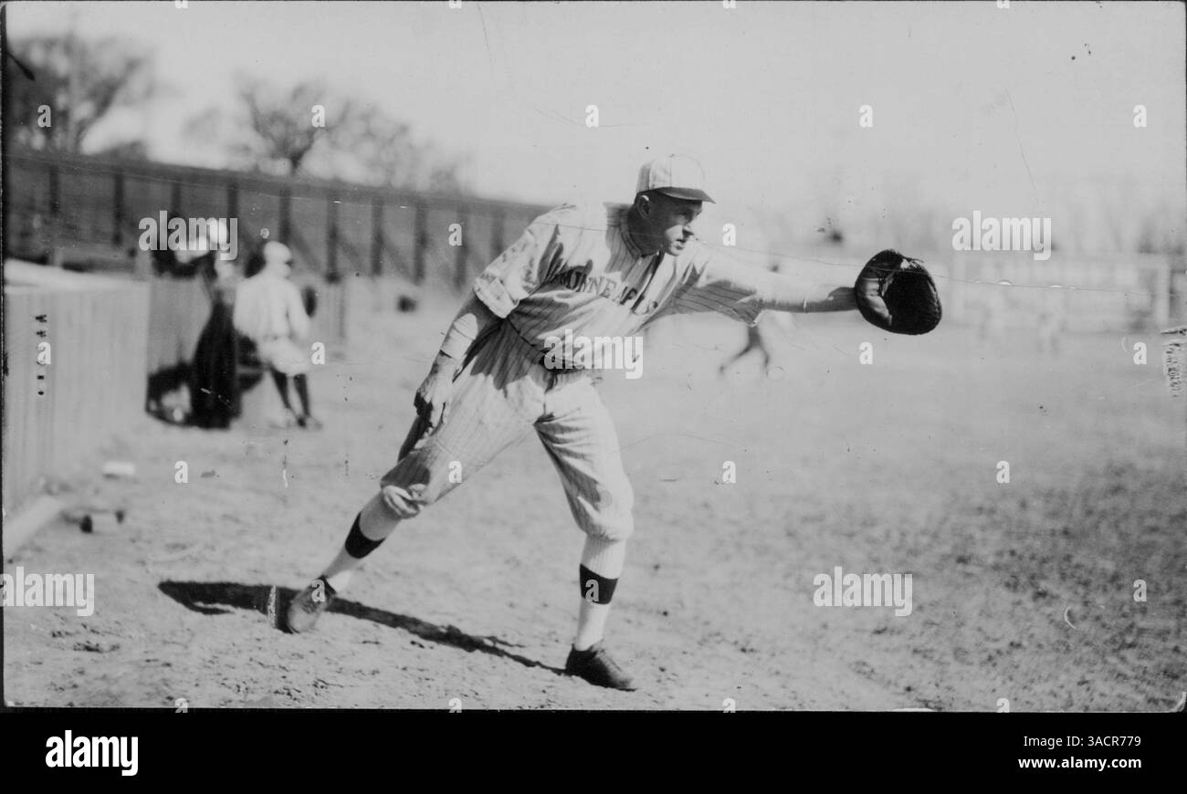 A photo of Wally Smith reaching for a wide one during a sporting event ...