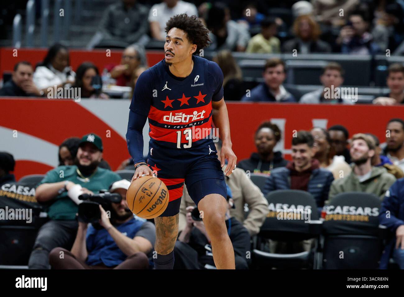Washington Wizards guard Jordan Poole (13) brings the ball up court ...