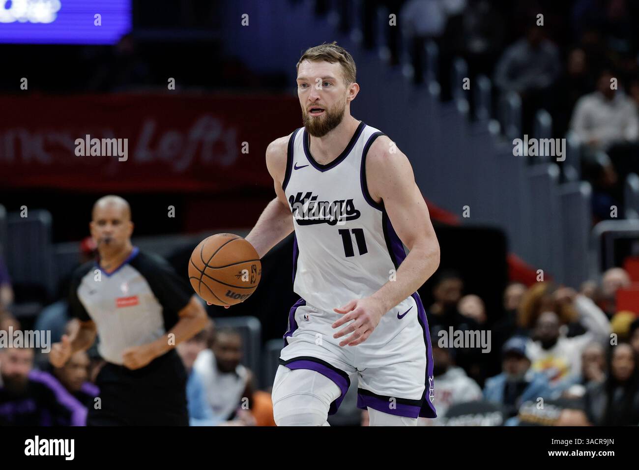 Sacramento Kings forward Domantas Sabonis (11) brings the ball up court during the second half ...