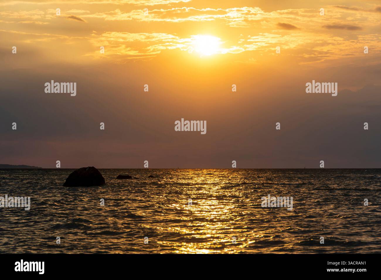 Beautiful golden sunset over the sea Stock Photo - Alamy
