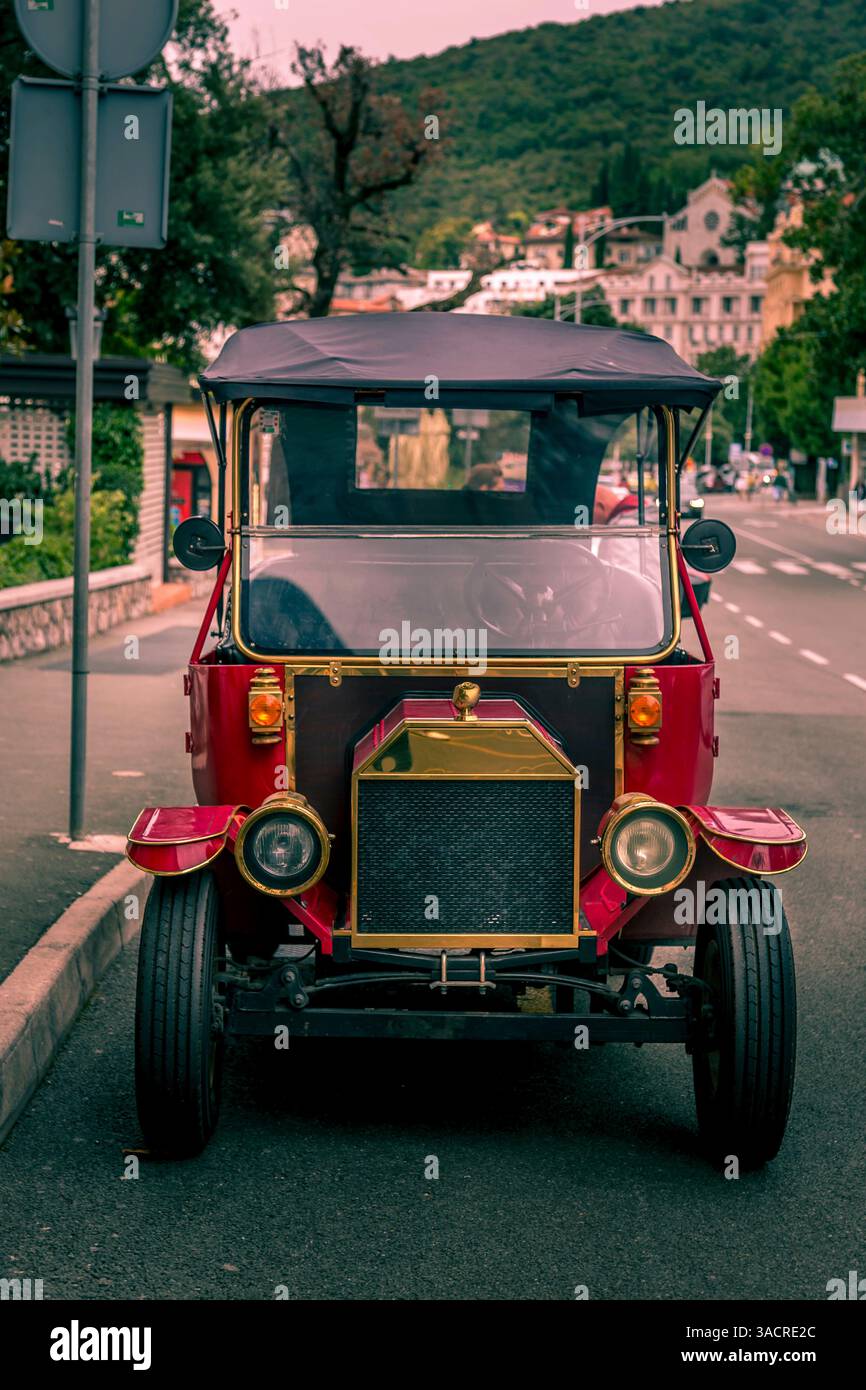Red vintage car on a road Stock Photo - Alamy