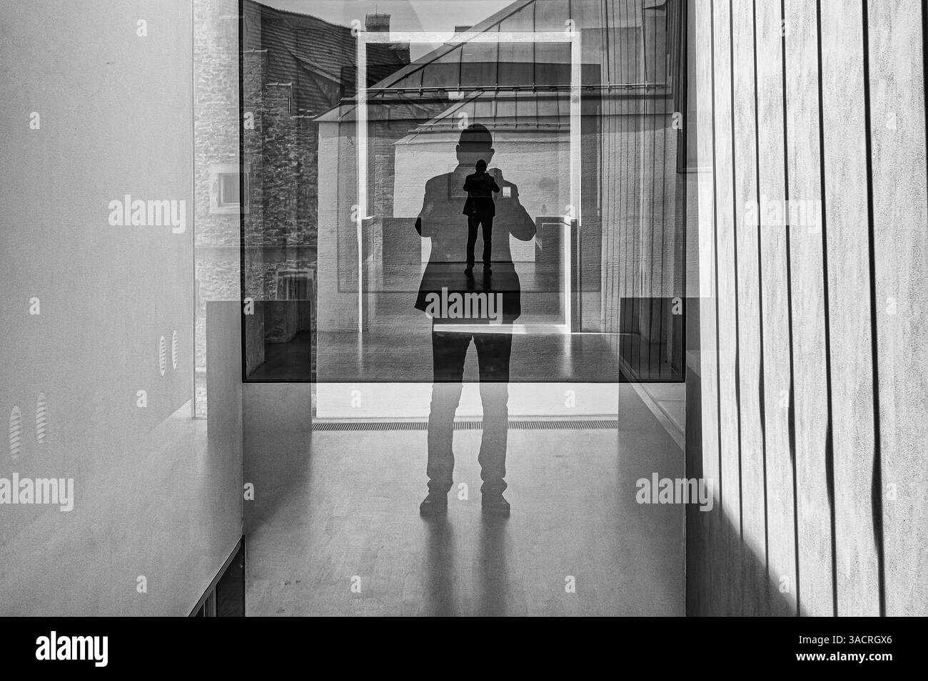 Self-portrait through doors and windows Stock Photo - Alamy