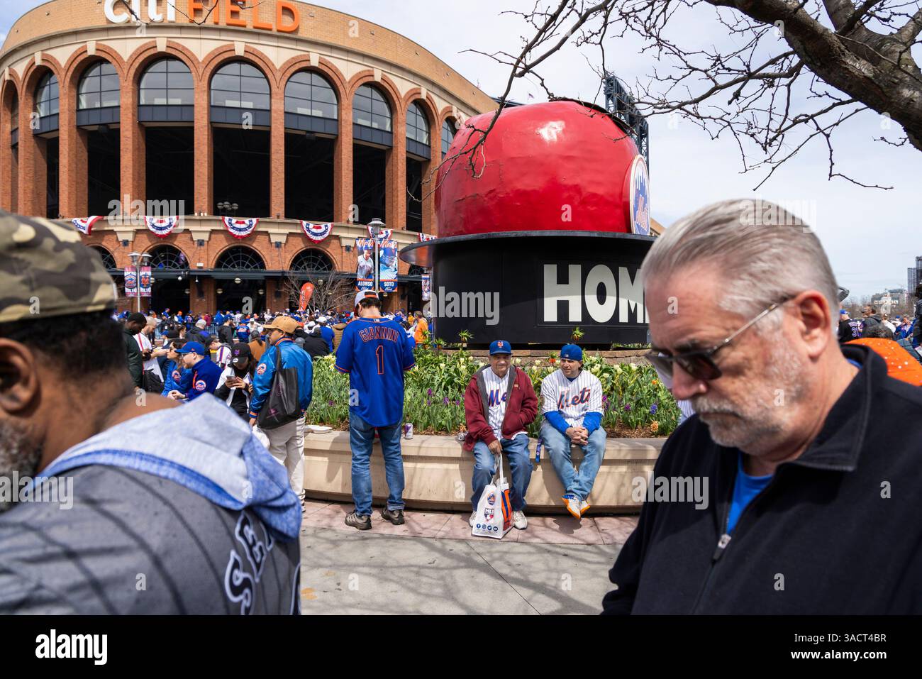 New York Mets fans wait to enter the stadium before an Opening Day MLB ...