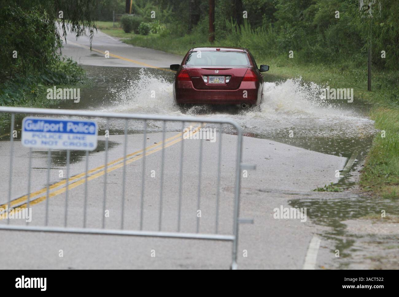 Sept. 4, 2011 - Gulfport, MS, USA - A driver goes through a flooded ...