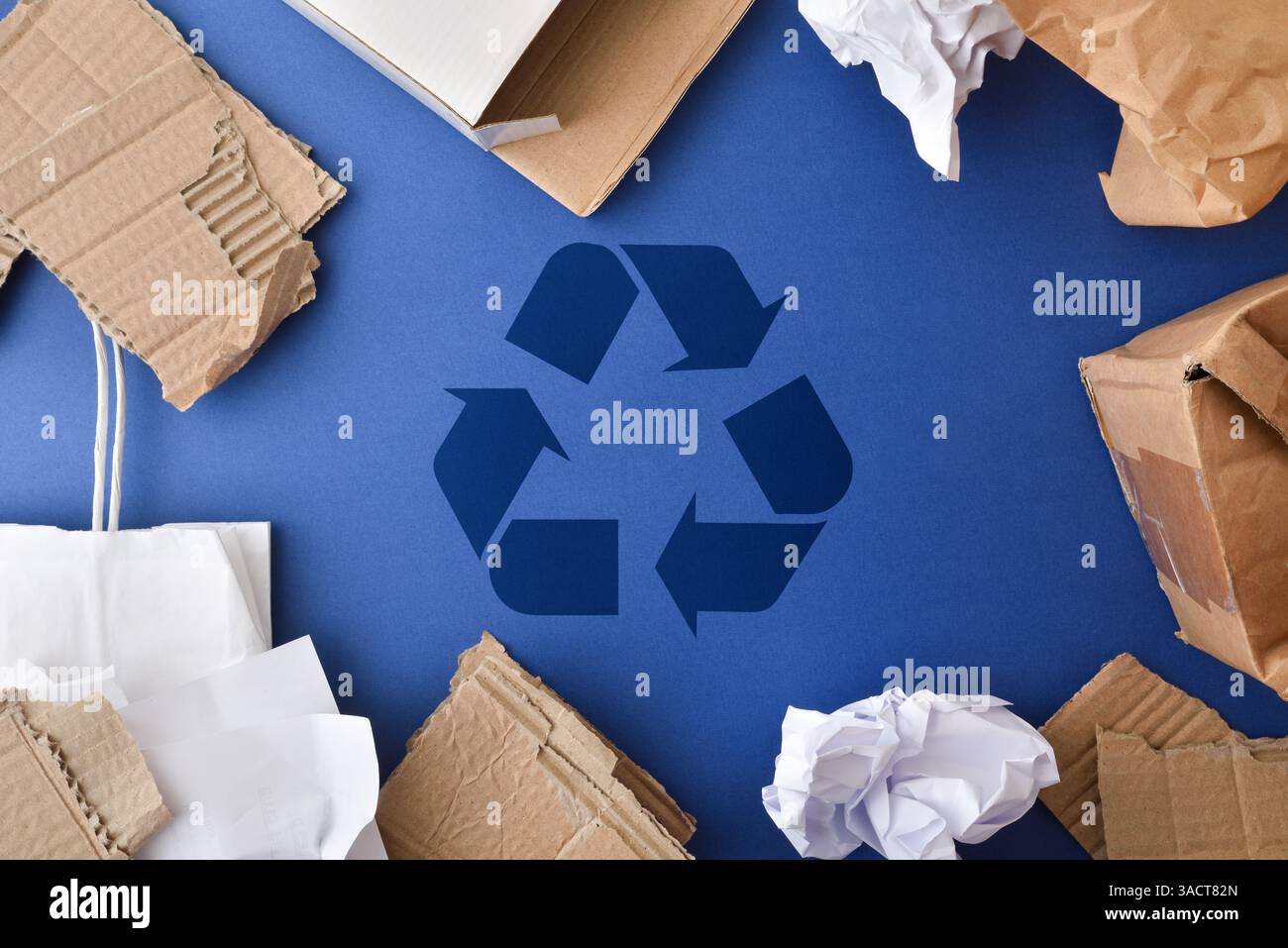 Paper and cardboard pollution and recycling concept with recycling ...