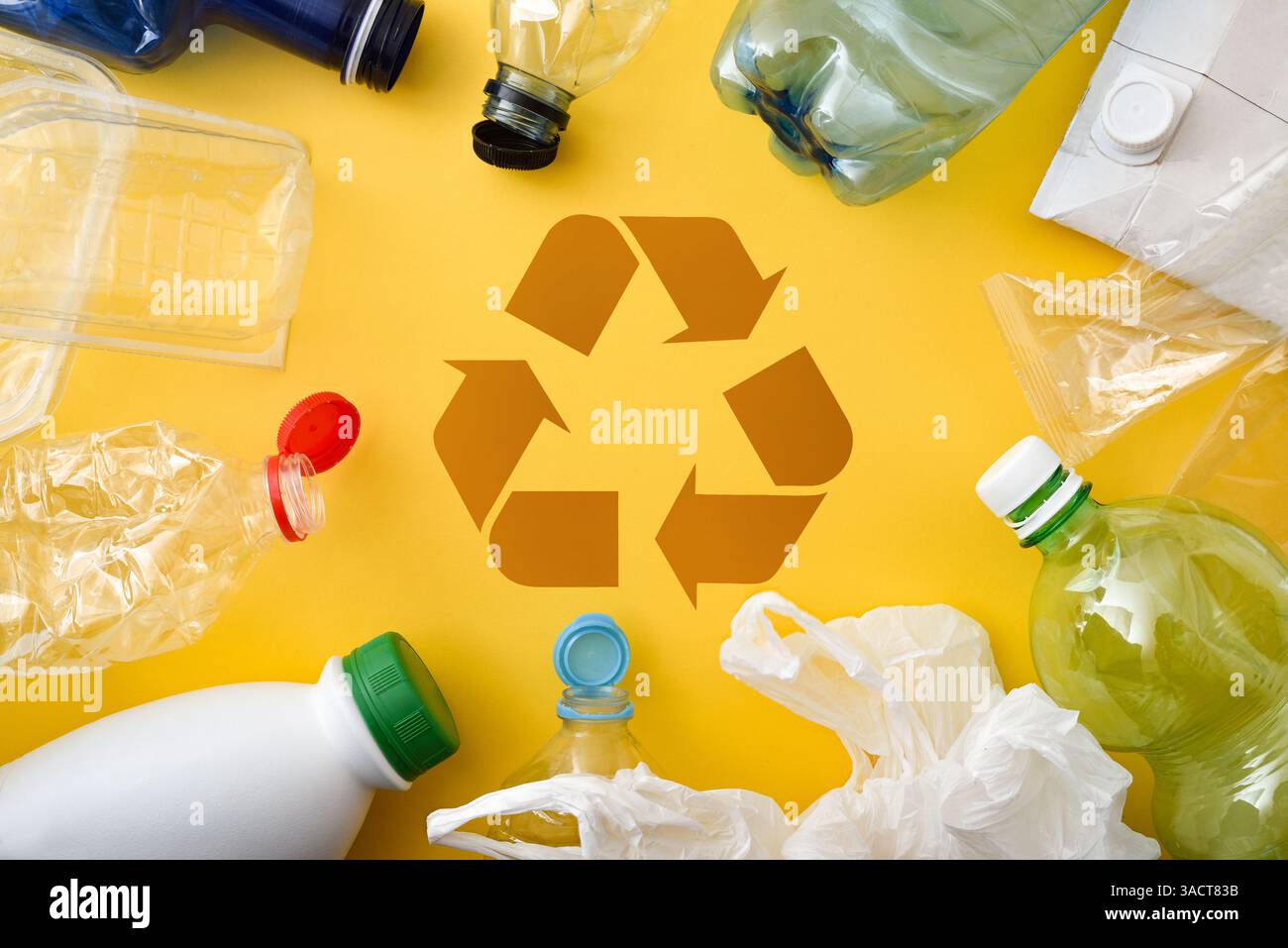 Plastics and packaging pollution and recycling concept with recycling ...
