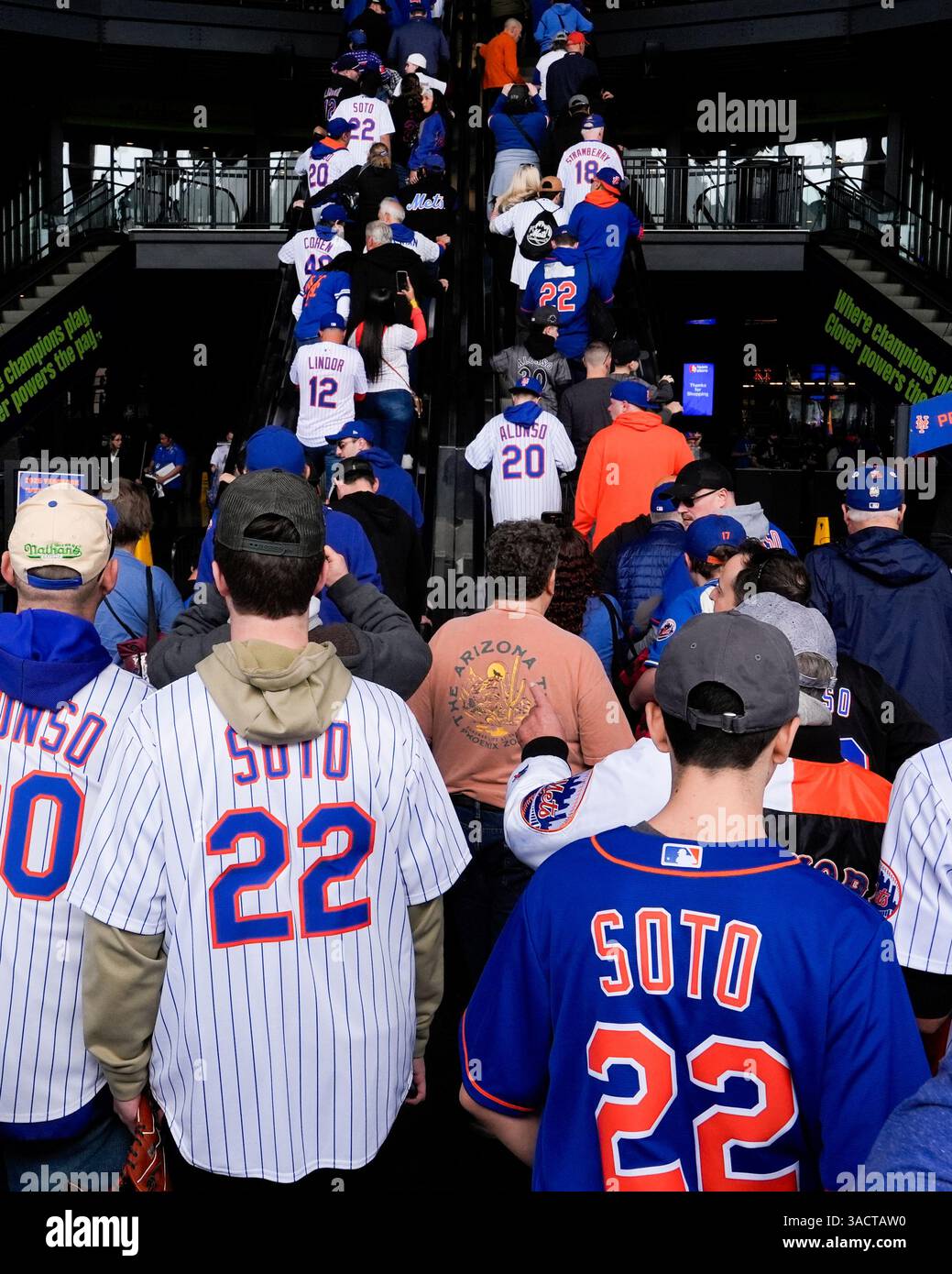 New York Mets fans ride the escalators to the concourse before a ...