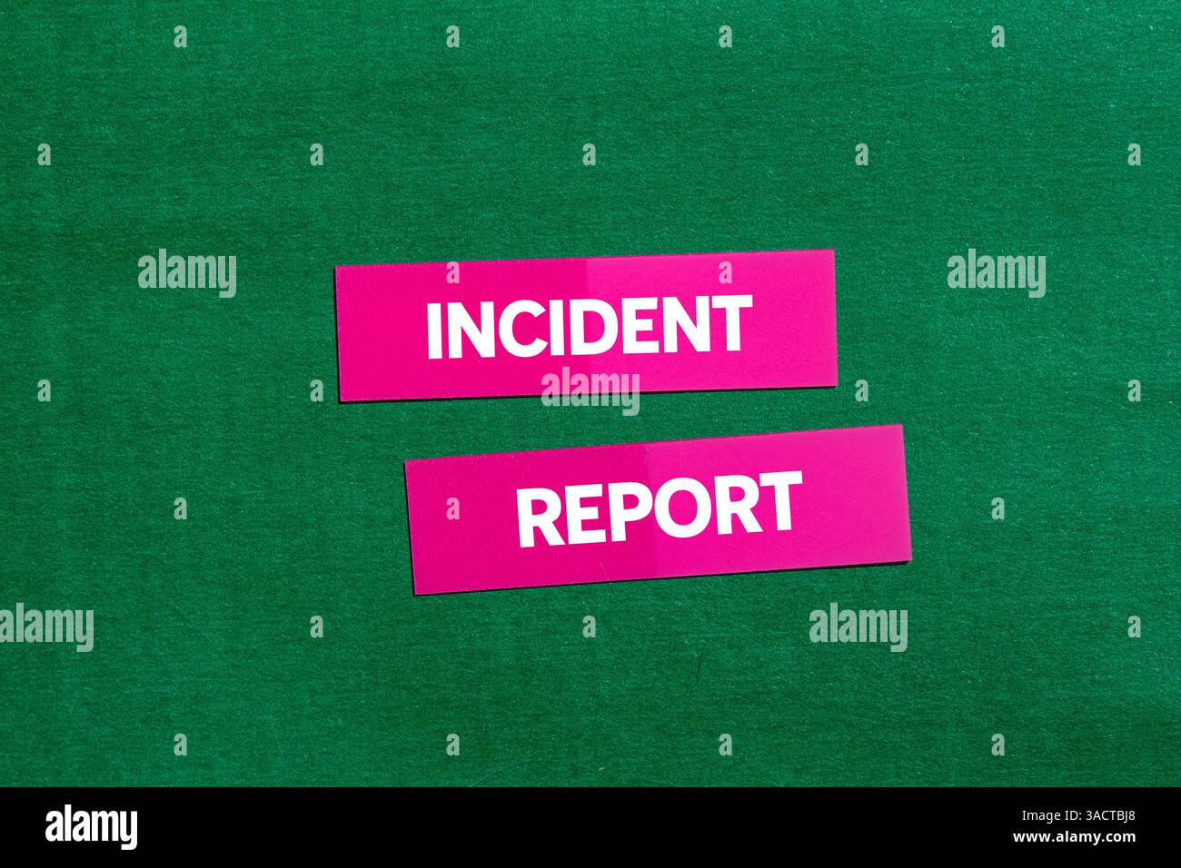 Incident report message written on pink stickers on green background ...