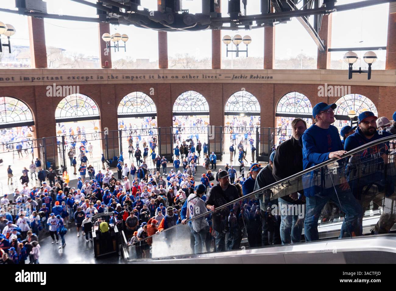 New York Mets fans ride the escalators to the concourse before a ...